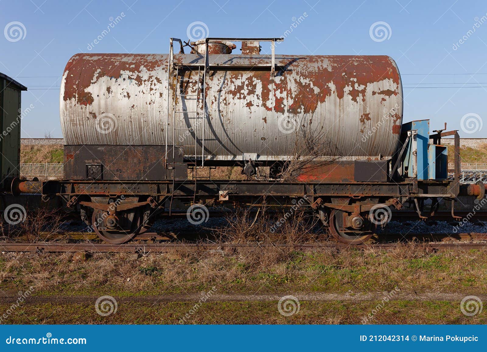 Wagon Of An Old Rusty Freight Train Stands On The Rails Stock Image ...
