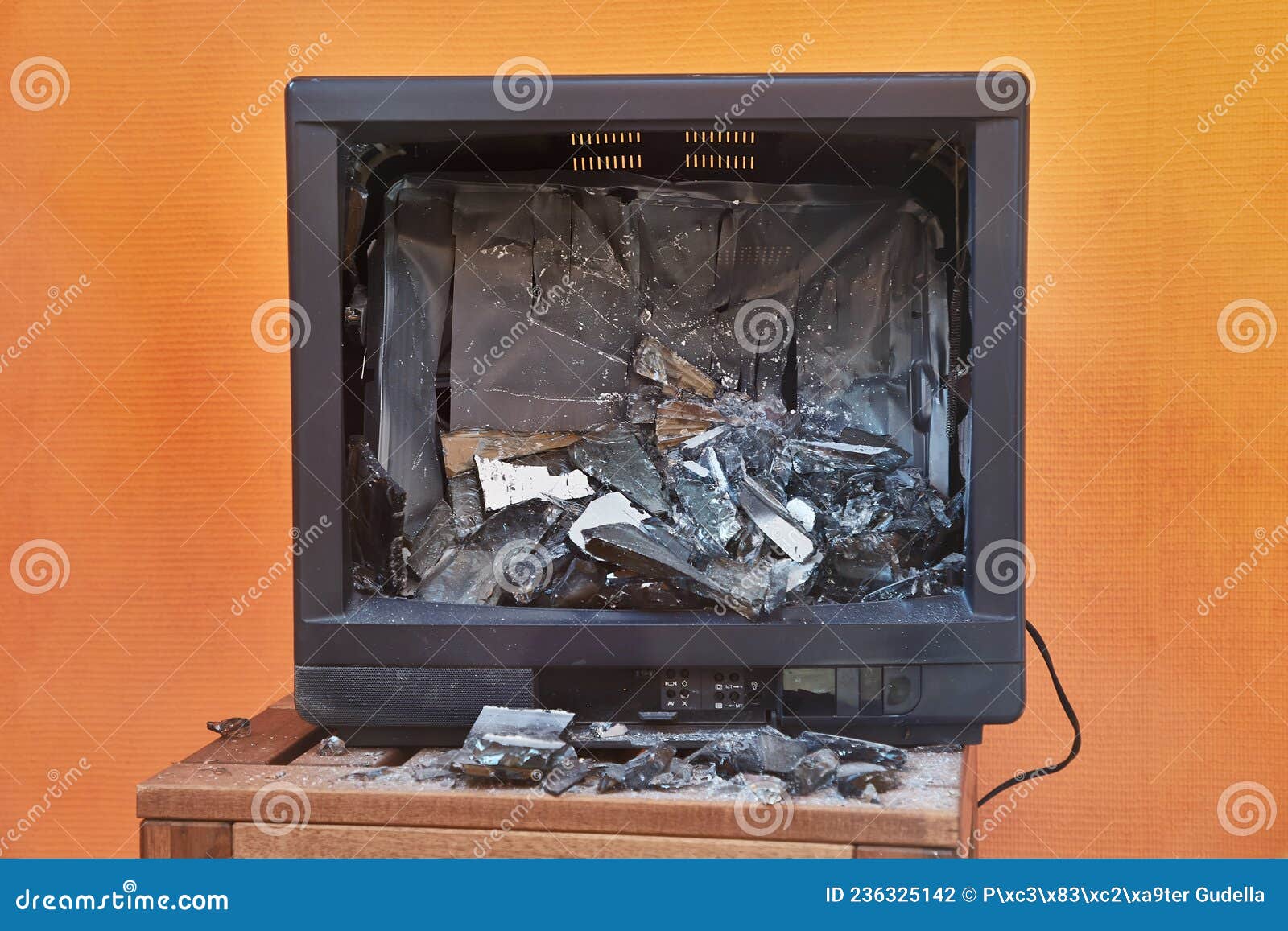 Old TV smashed to pieces stock photo. Image of broken - 236325142