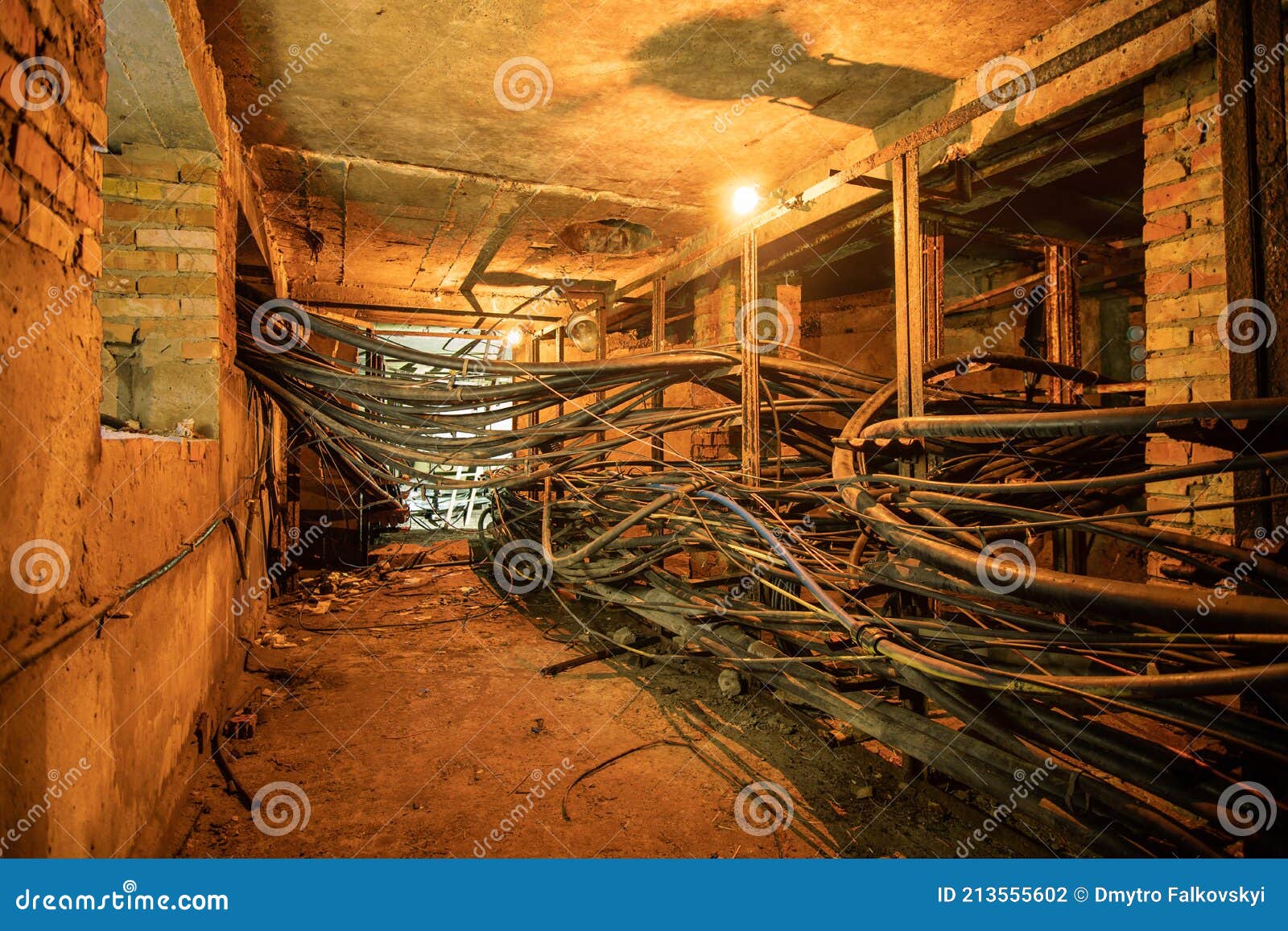 An Old Underground Brickwork Cable Tunnel or Basement with Cables Stock ...