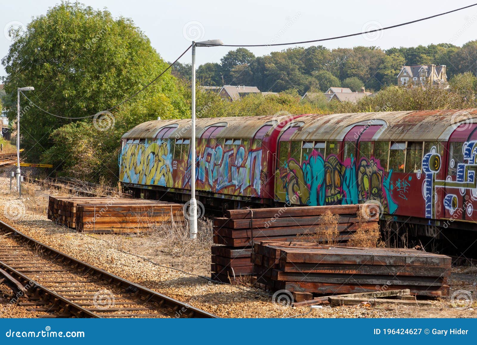 An Old Underground or Tube Train Covered in Graffiti on the Side of a ...