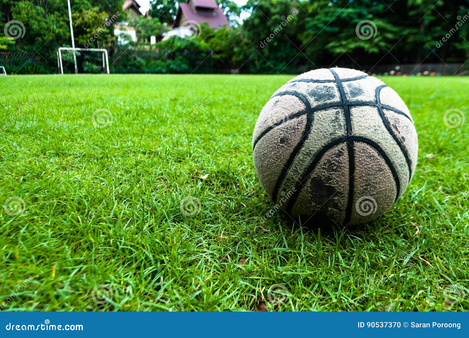 Old Used Ball on Grass Field Stock Photo - Image of equipment, poor ...