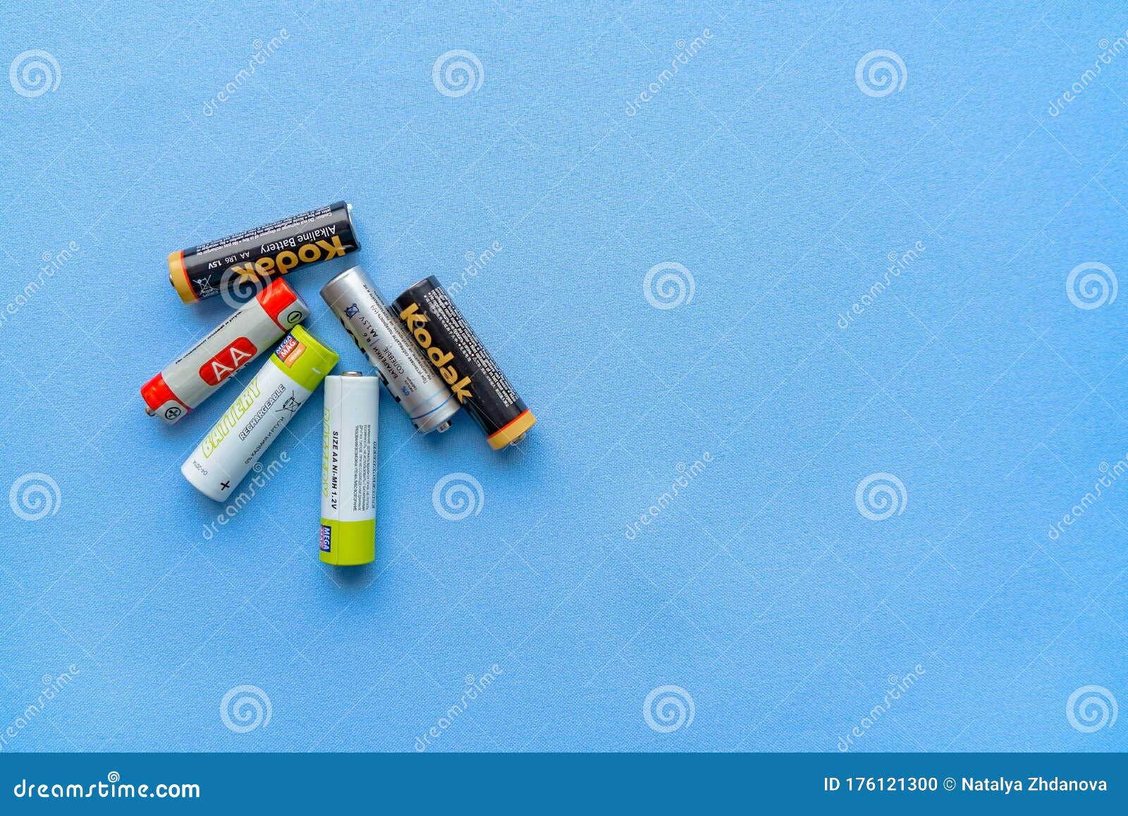 Old Used Batteries on a Blue Background Close-up with Space for Text ...