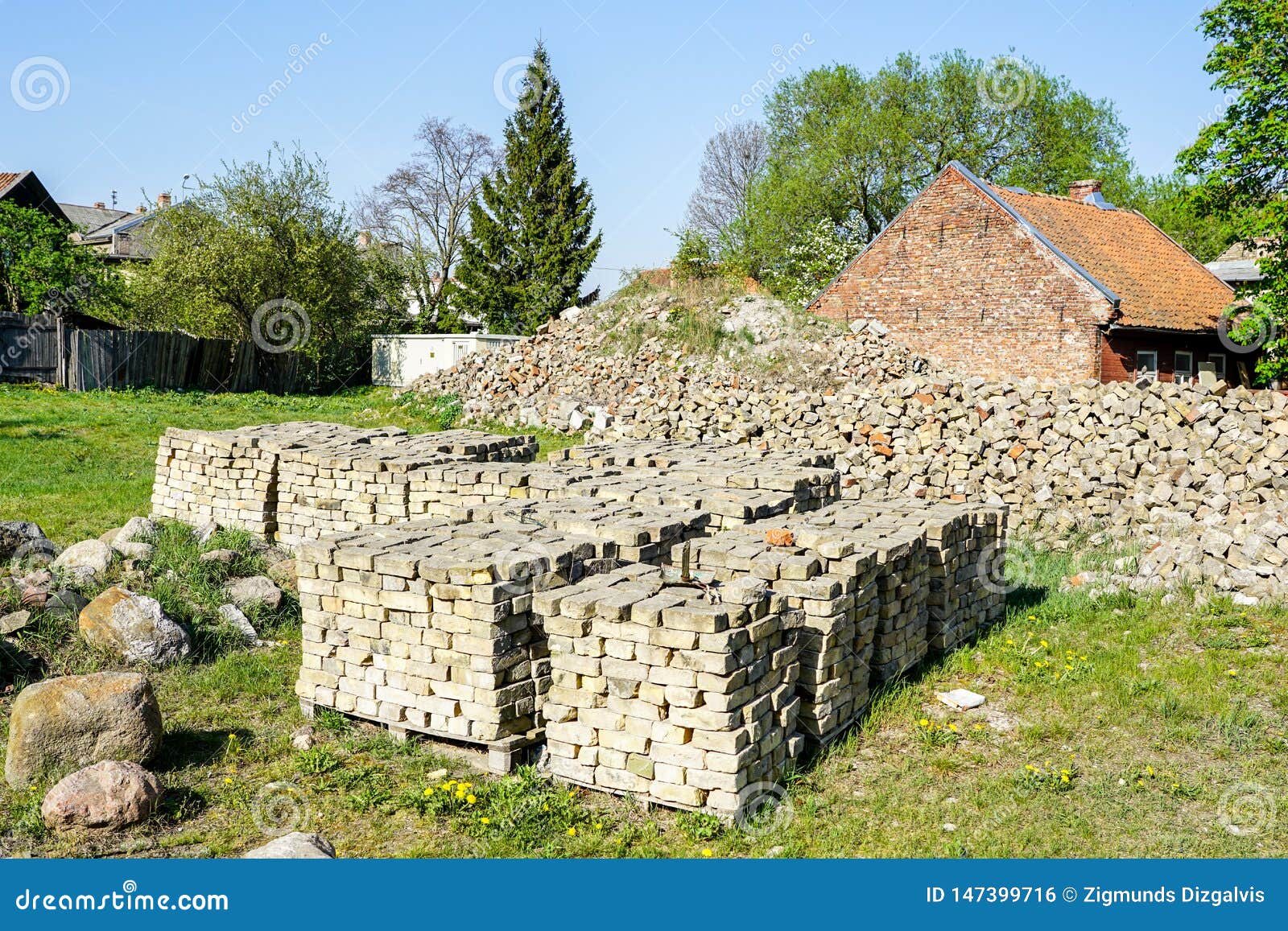 Old Used Bricks, Stacked Into Cubes On Pallets Stock Photo ...