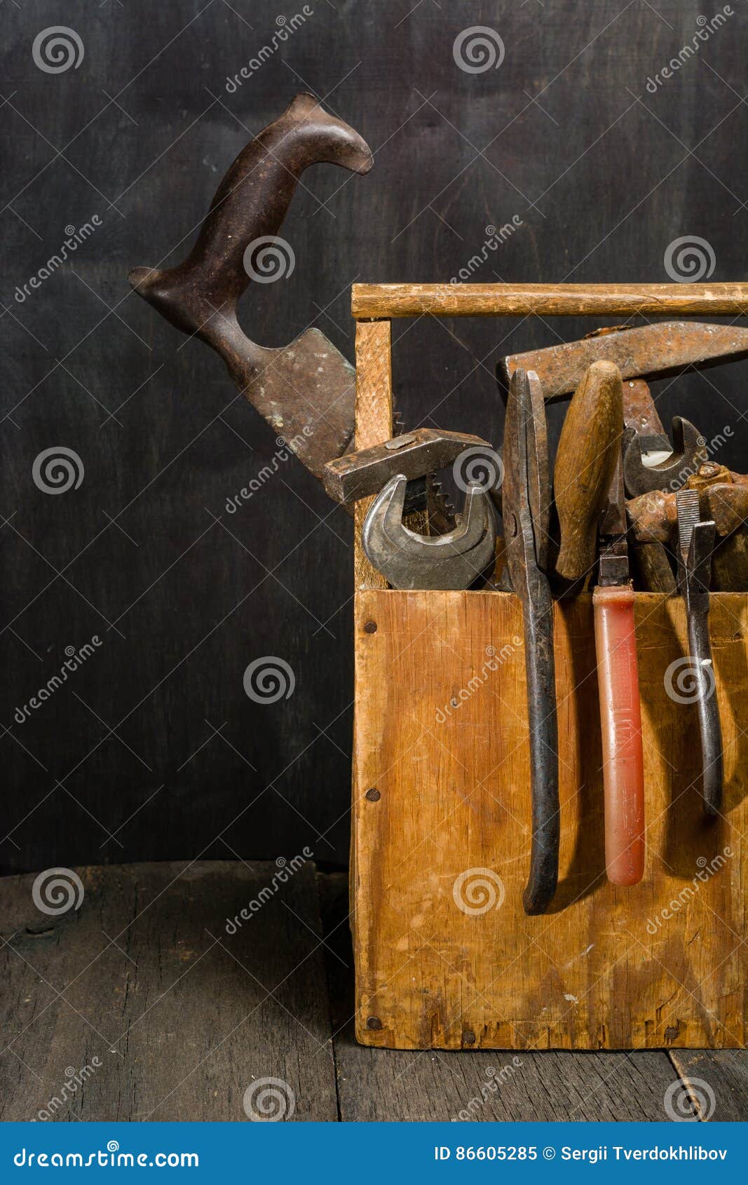 Old Used Tools in the Toolbox. Dark Background. Spot Lighting. Wooden ...