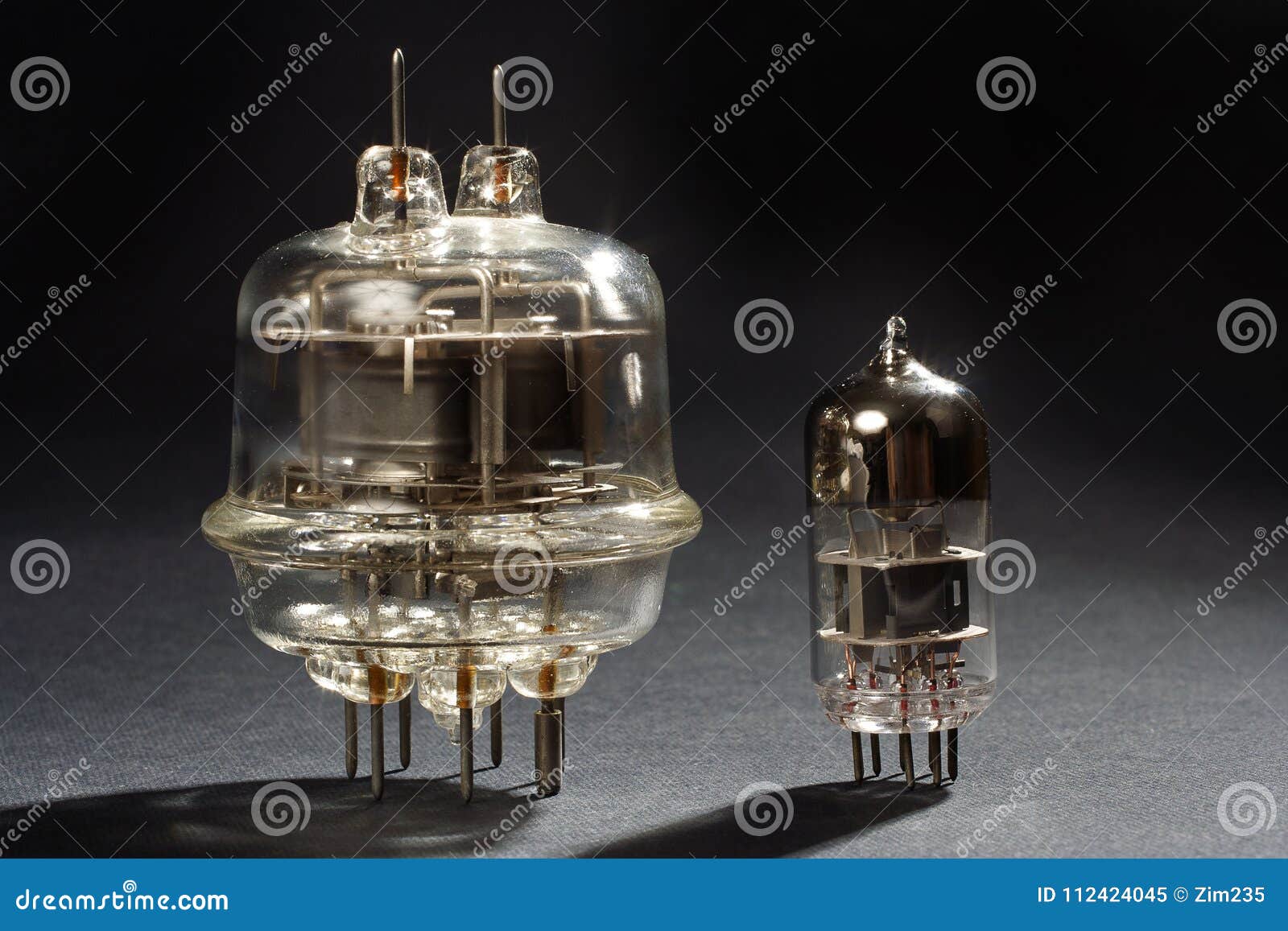 Old vacuum tubes on black stock image. Image of electrical - 112424045