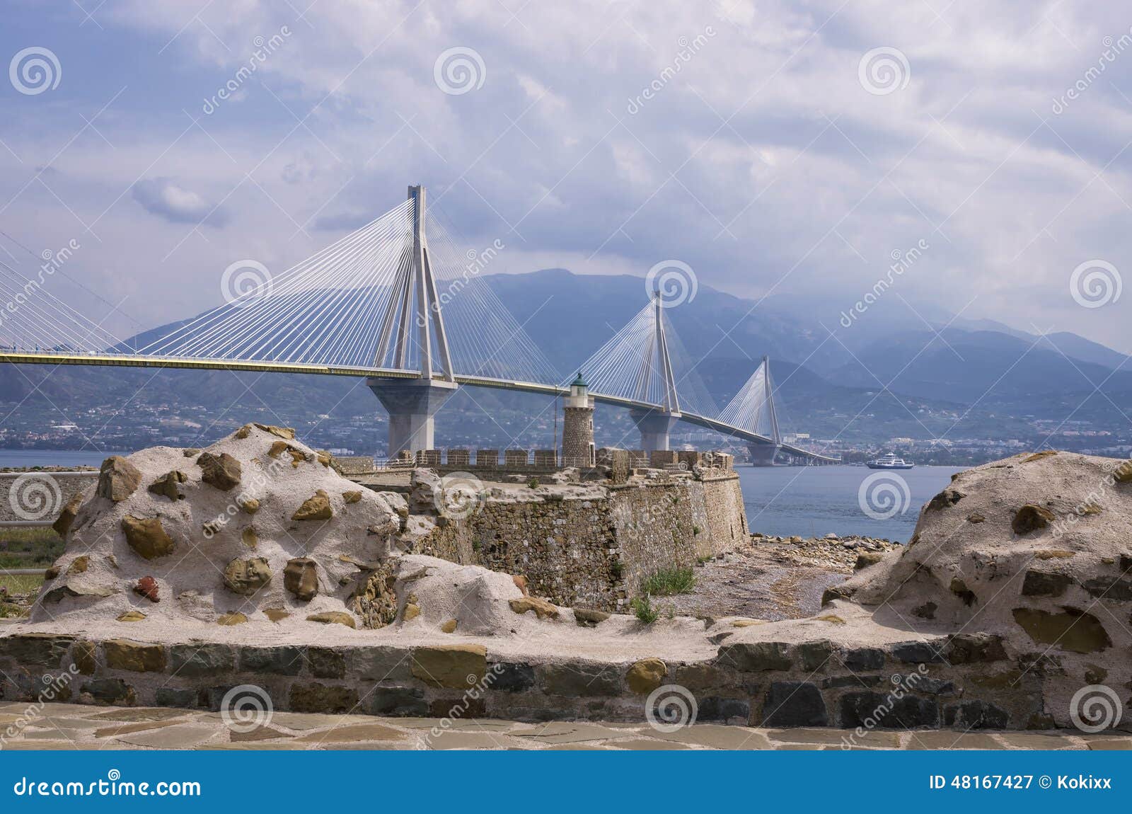 Old Versus New, Aged Lighthouse Versus Modern Cable Bridge Stock Image ...