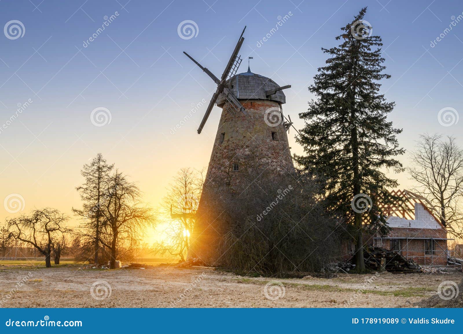 Old Vintage Abandoned Windmills in Sunset Stock Image - Image of ...