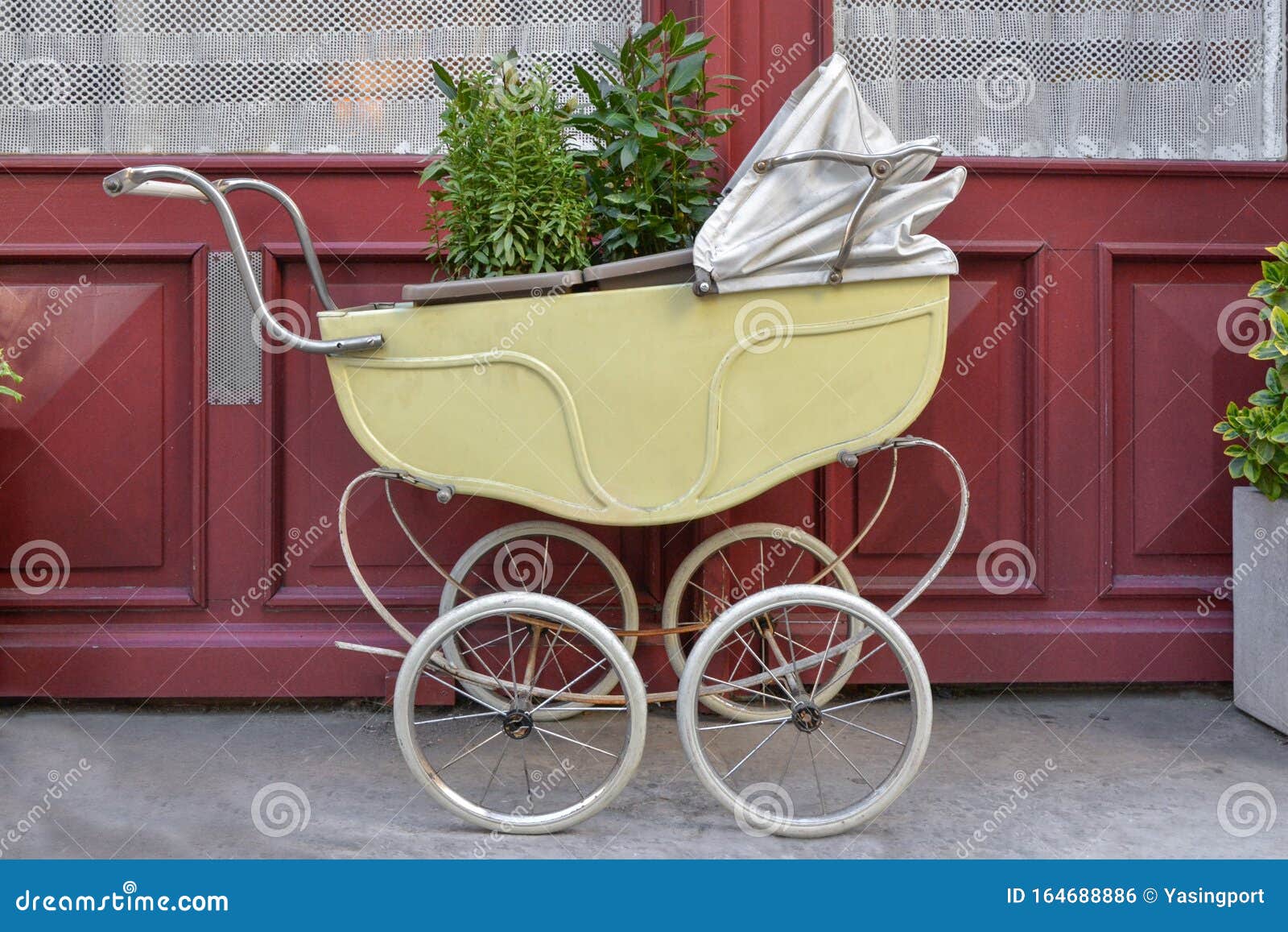 Old Vintage Baby Stroller Outdoors with Plants Stock Photo - Image of ...