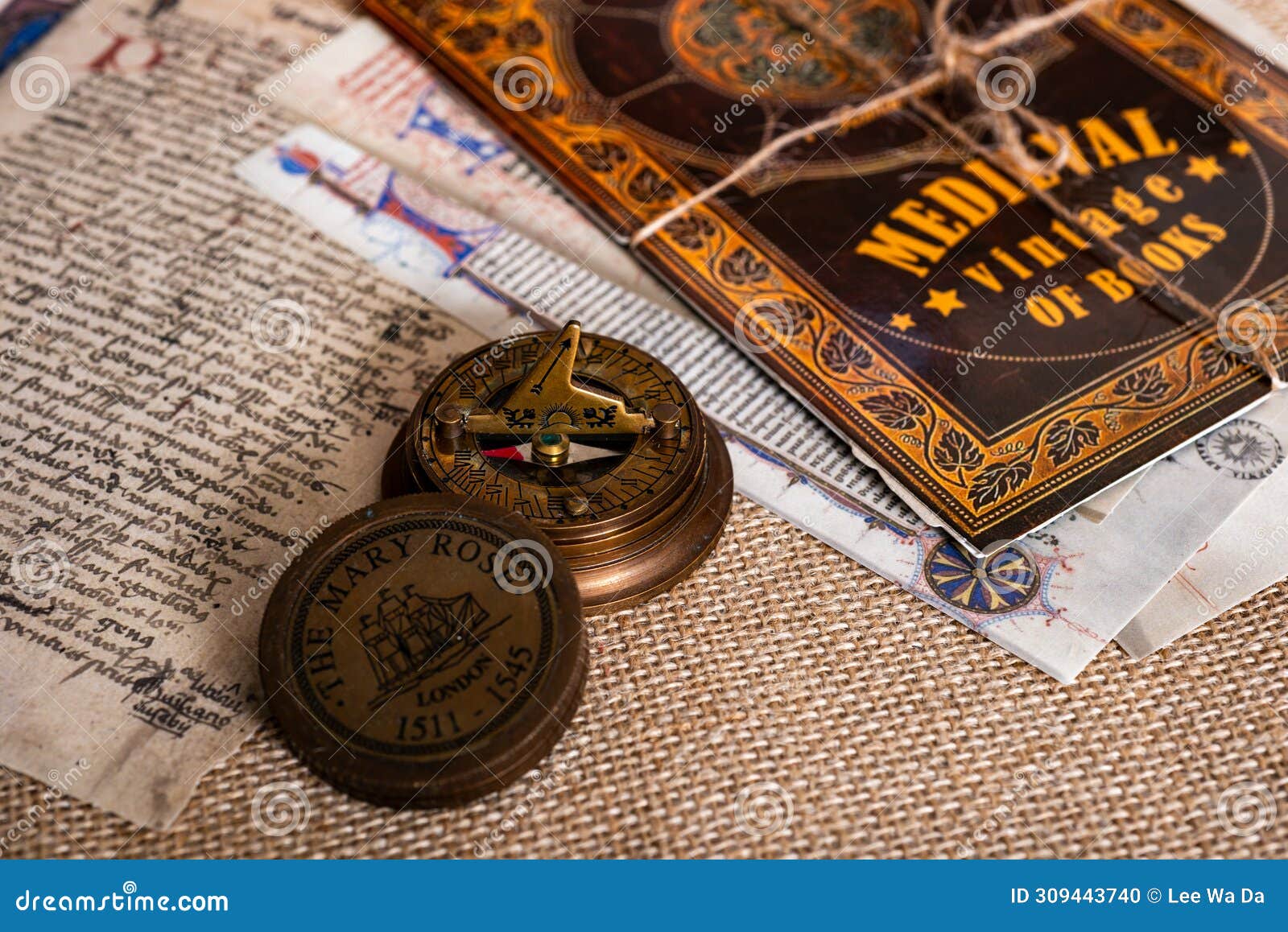 Old Vintage Brass Compass with Sundial Lying on a Very Old Medival Hand ...