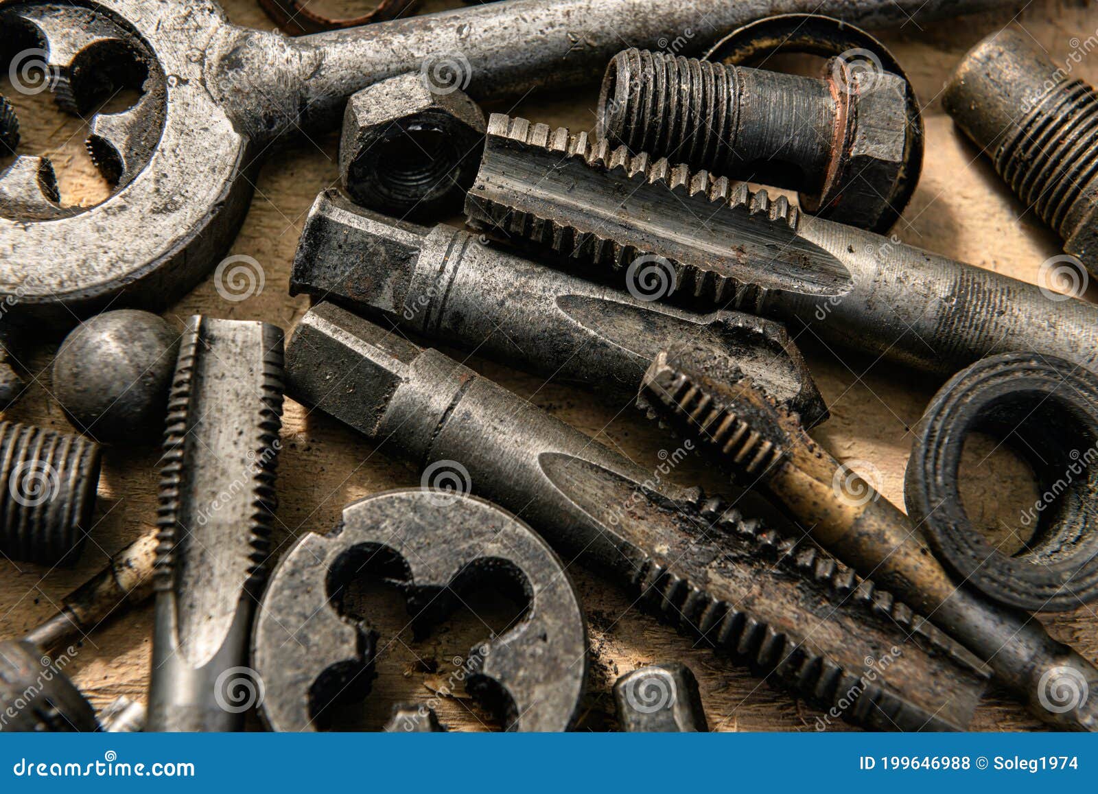 Old Vintage Drills and Threading Die Tools on a Wooden Background Stock ...