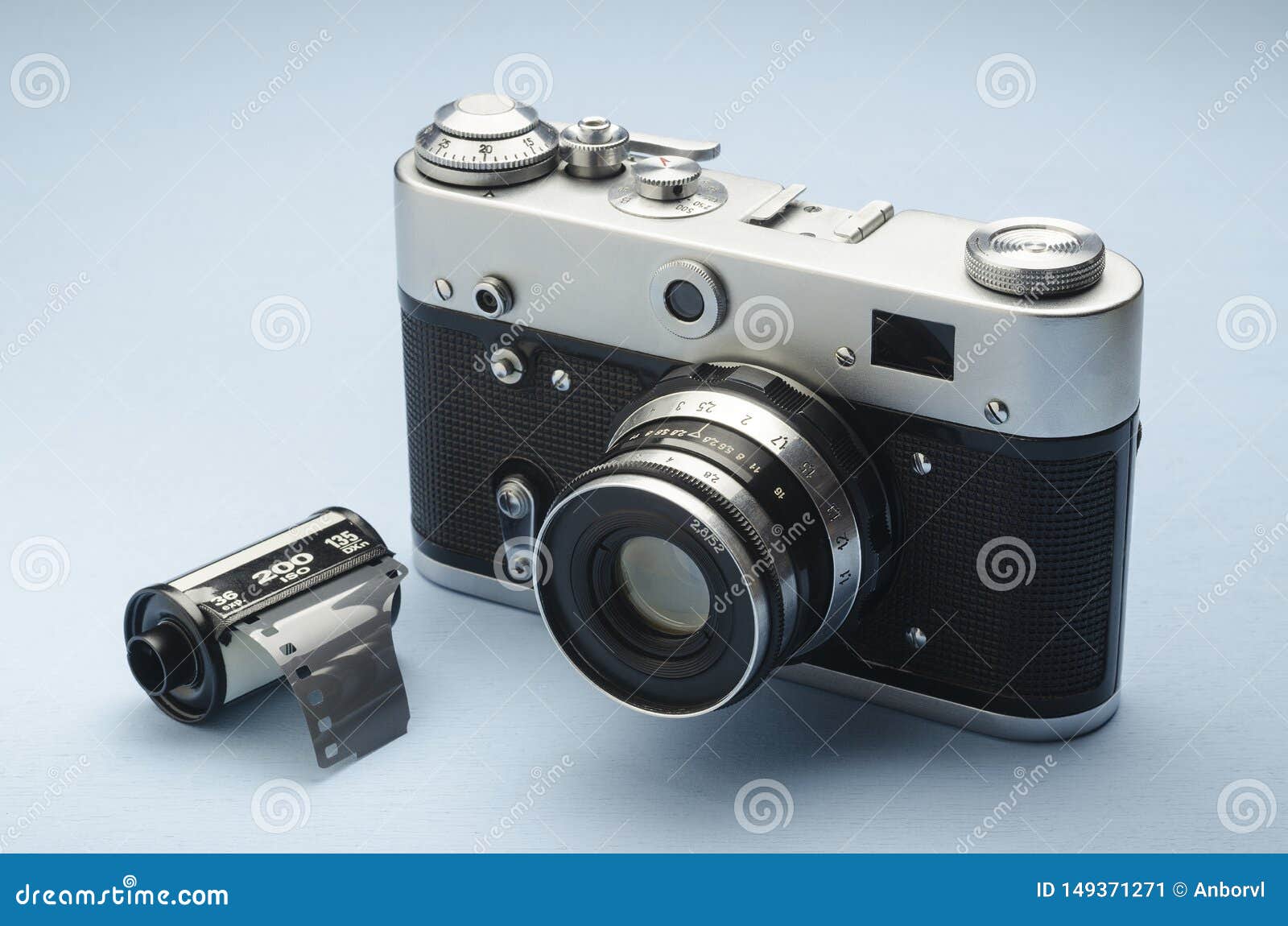 Old Vintage Film Analog Camera and 35mm Film on Blue Background Stock ...