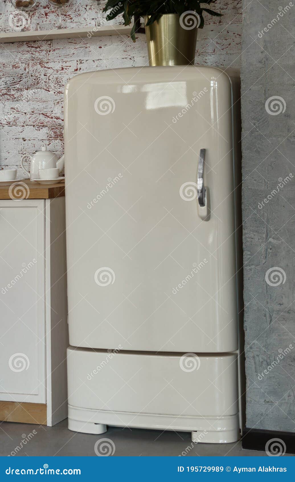 Old Vintage Fridge with Chrome Handle in Loft Style Kitchen Stock Image ...
