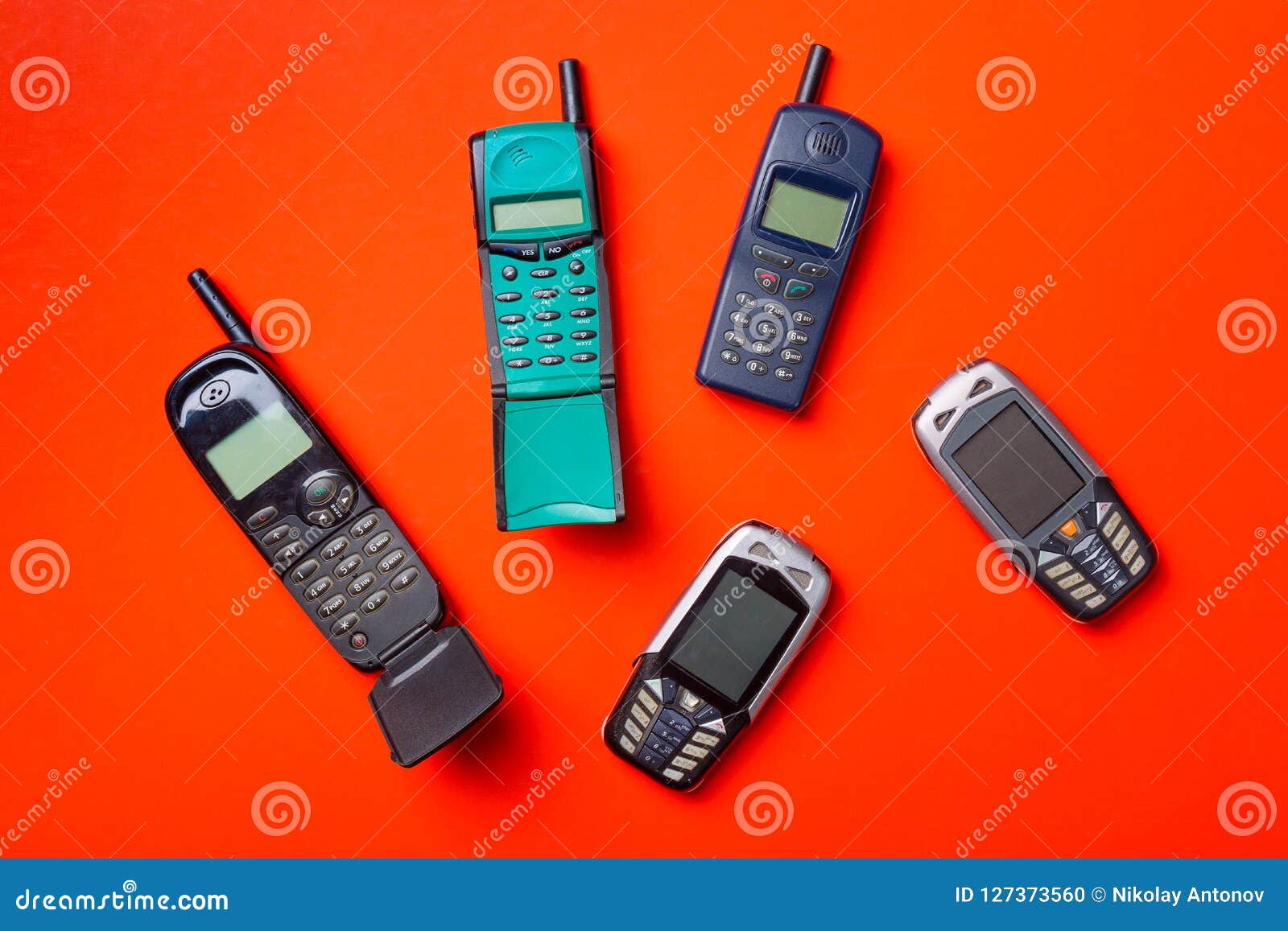 Old Vintage Mobile Cell Phones on Red Orange Background Stock Photo ...