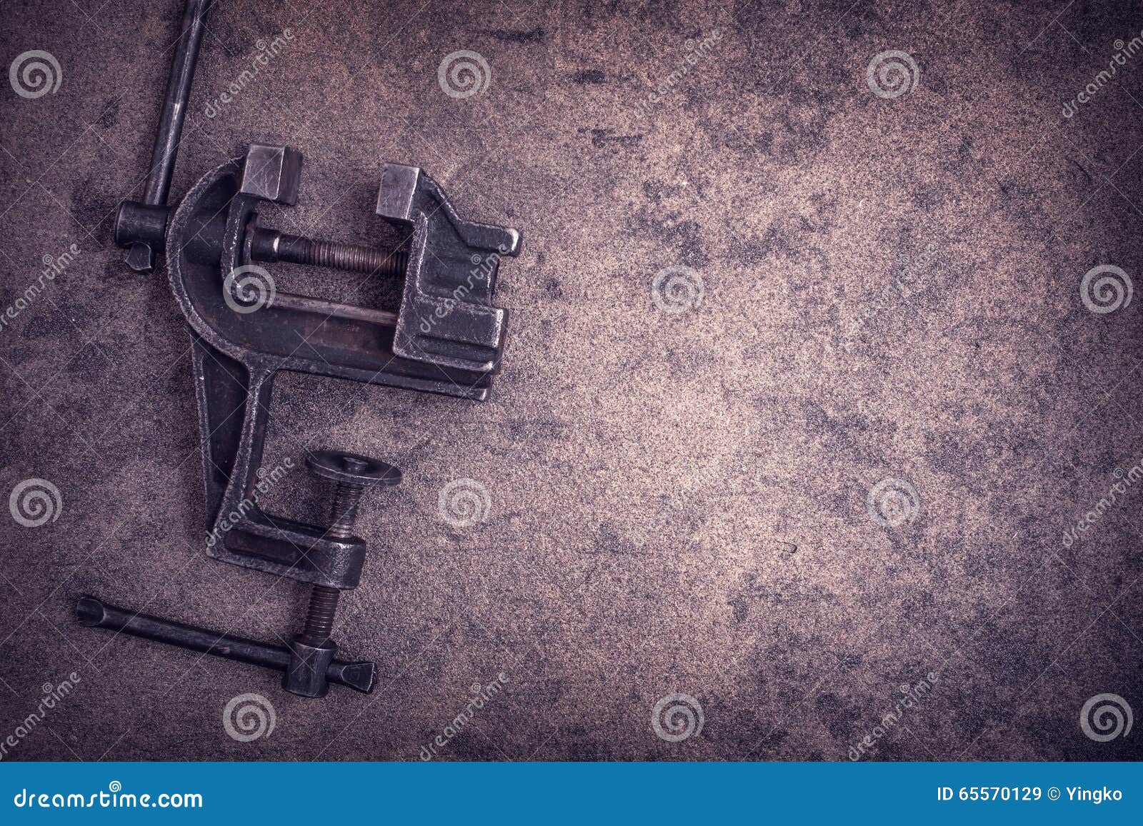 Old vise on grunge surface stock image. Image of clamp - 65570129