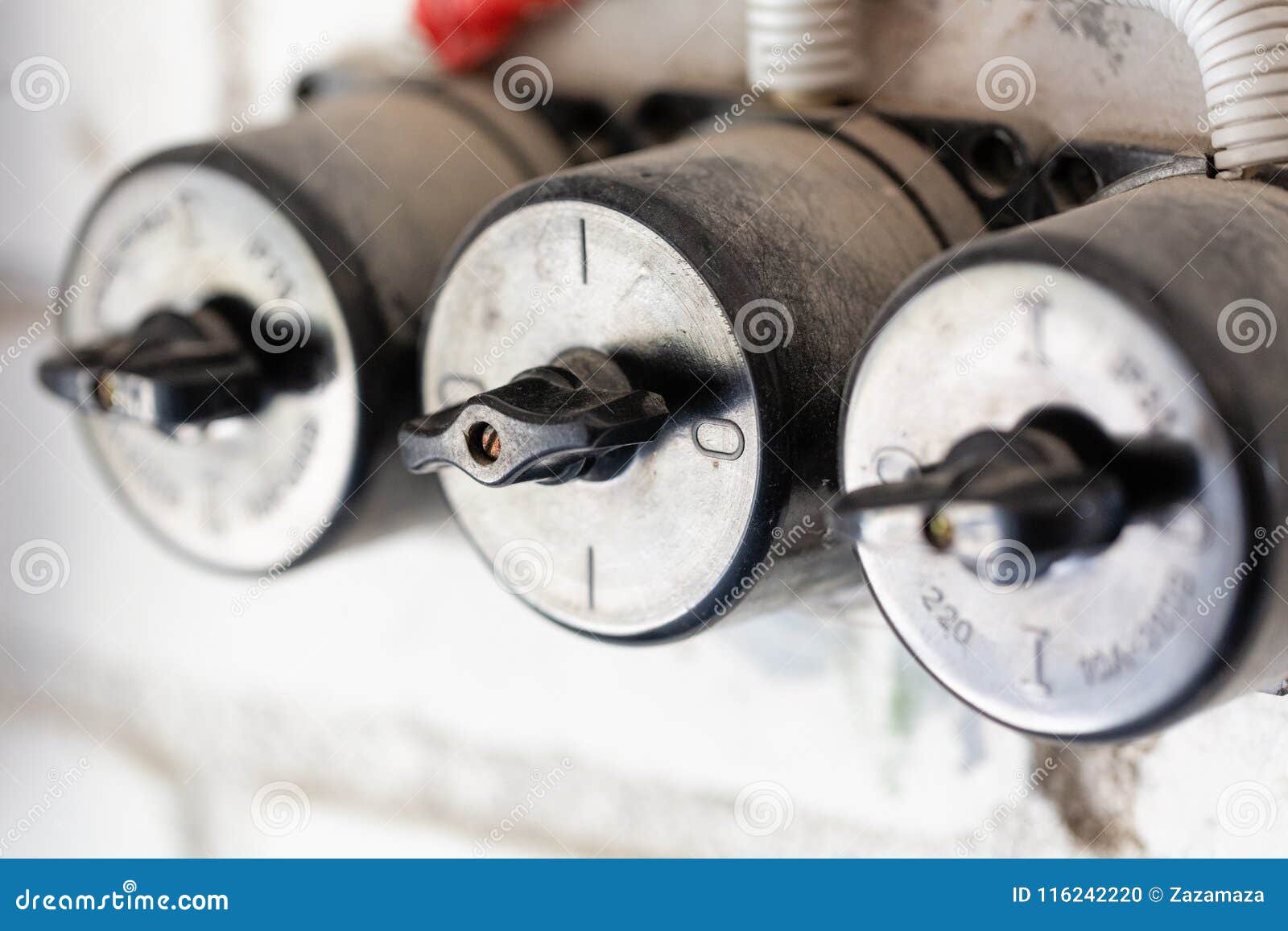 Old Voltage Electrical Power Switches in the Row. Close-up. Stock Photo ...