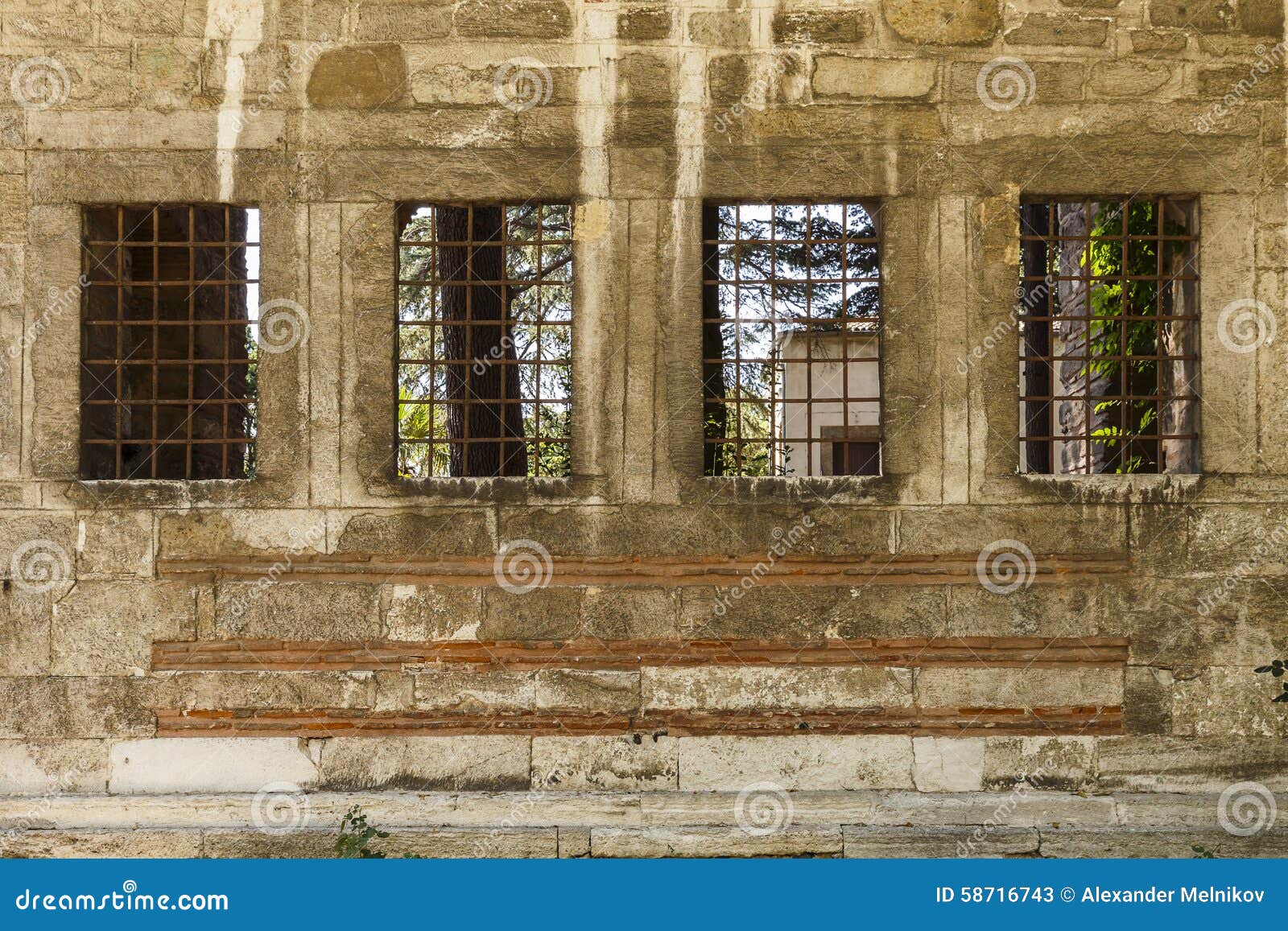 Old Wall of a Building with Four Windows and Grilles Stock Image ...