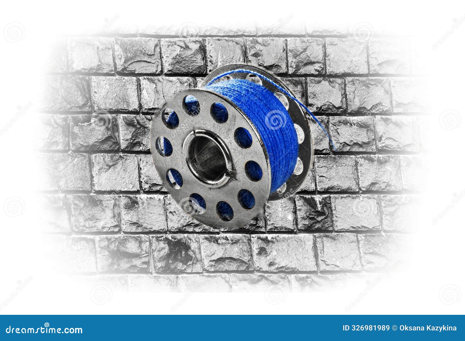 Old Wall Lined with Black Stone with Blue Threads on a Sewing Bobbin ...