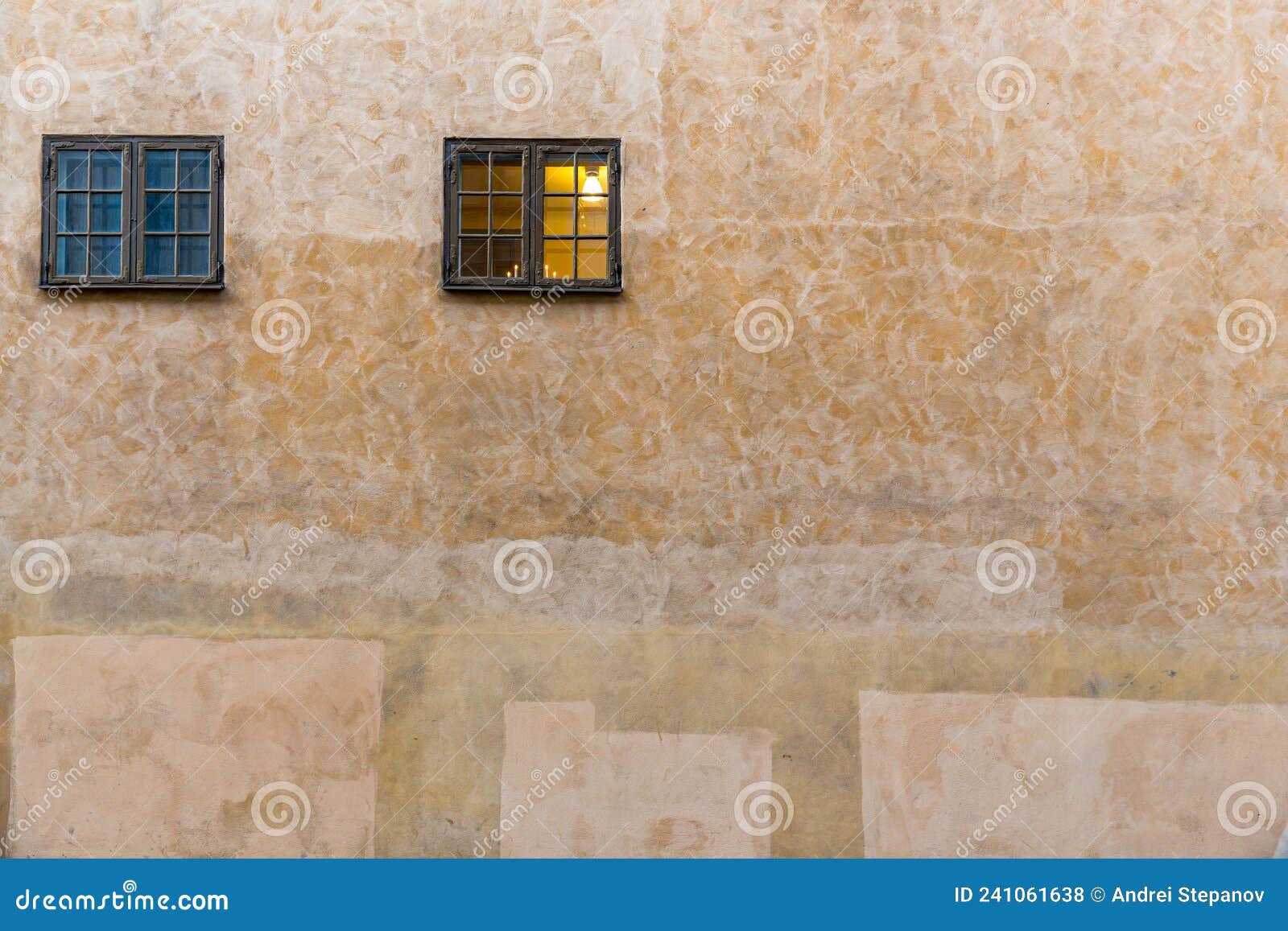 Old Wall with Two Small Windows. a Light is on in the Window Stock ...