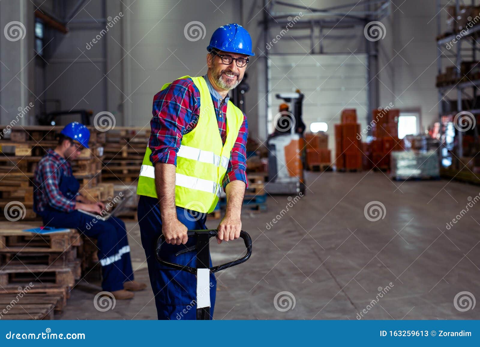 Warehouse Workers Pulling a Pallet Truck. Stock Image - Image of store ...