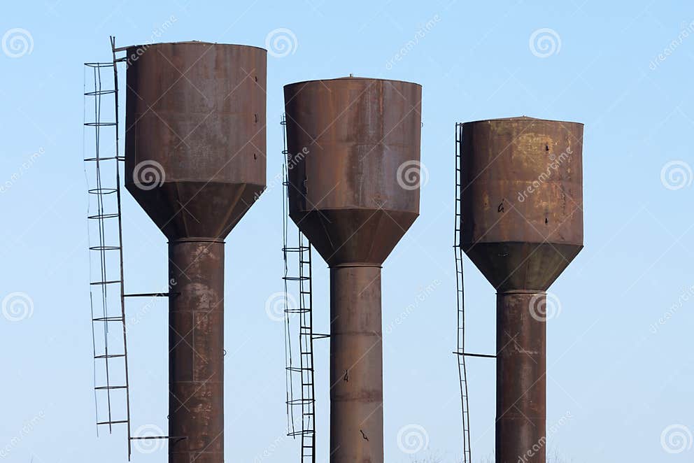 Old Water Towers. Rusty Metal Engineering Structures Stock Photo ...