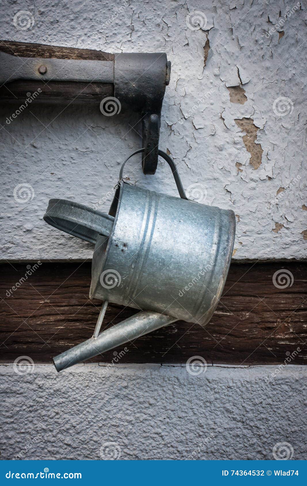 The Old Watering Can and Rocker on Wall of Farmhouse Stock Photo ...