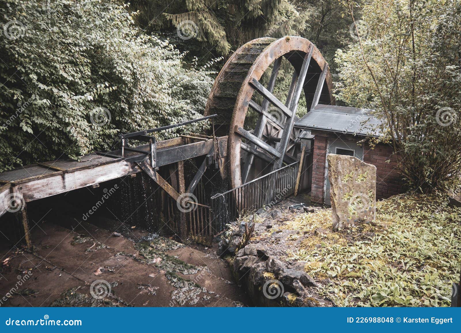 The Old Watermill Wheel is Driven by the Water of a Small Stream Stock ...