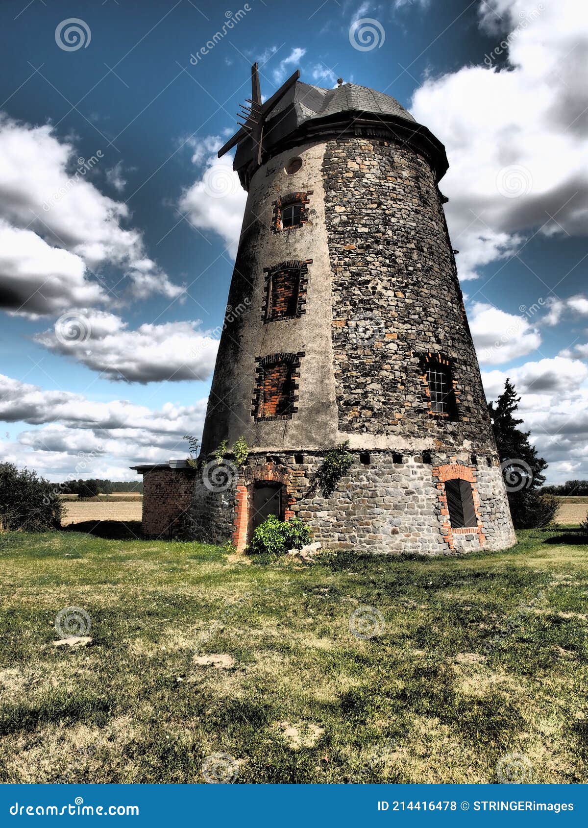 Old Weathered and Defunct Wind Mill in Dramatic Weather Stock Photo ...