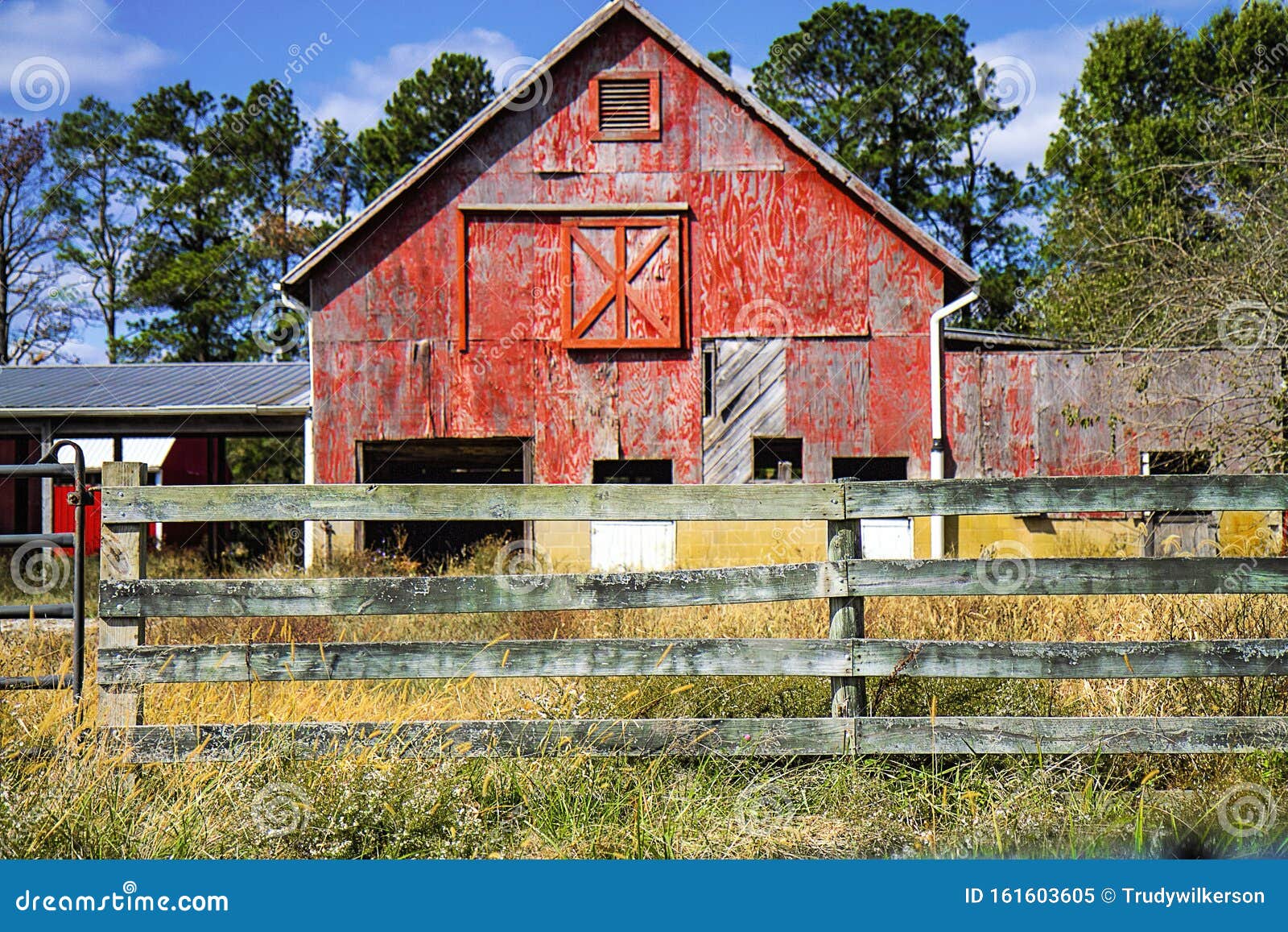 Old Weathered Red Barn With Split-rail Fence In Forefront Stock Image ...