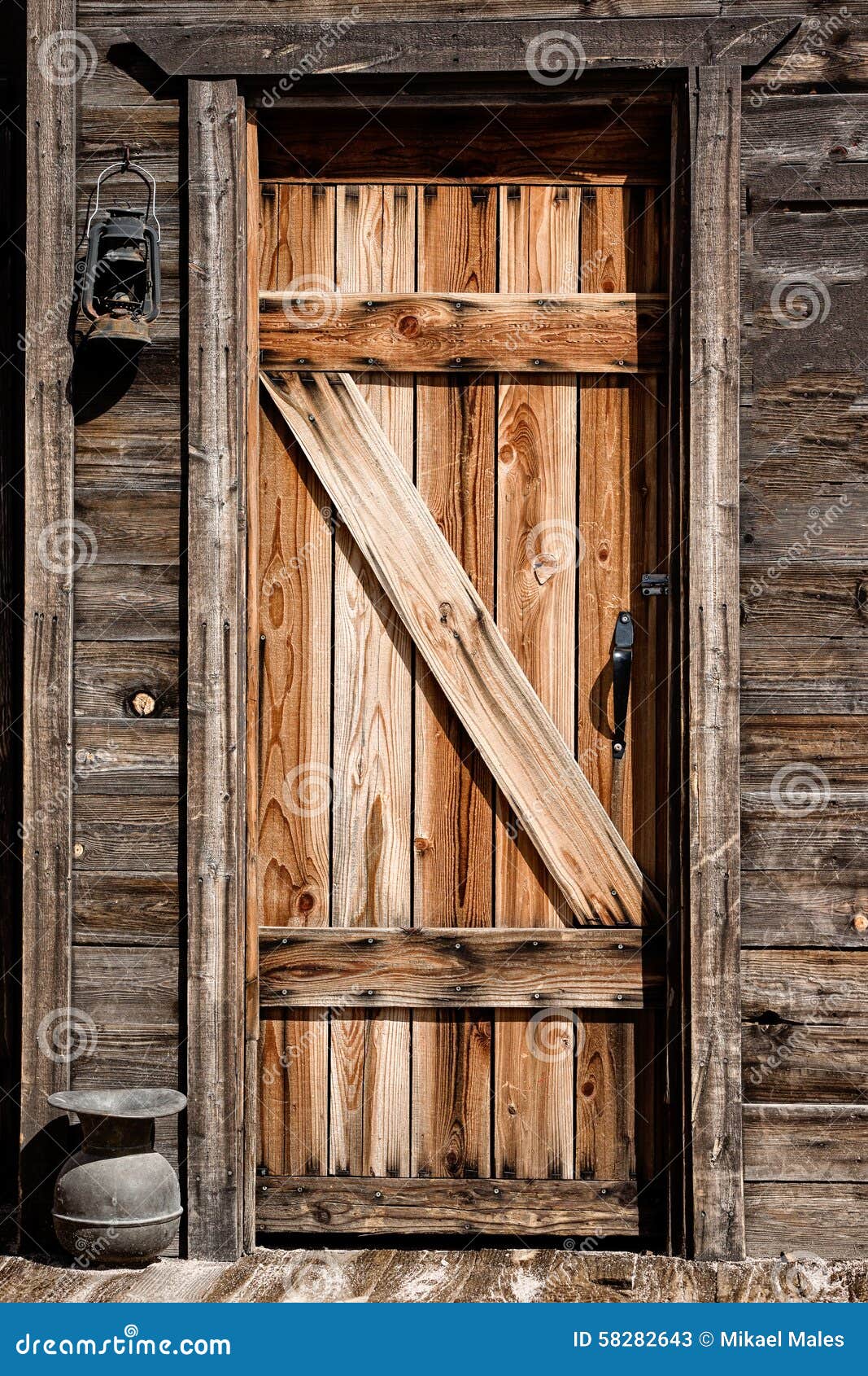 Old Western Door with Lantern in Front Stock Image - Image of spittoon ...