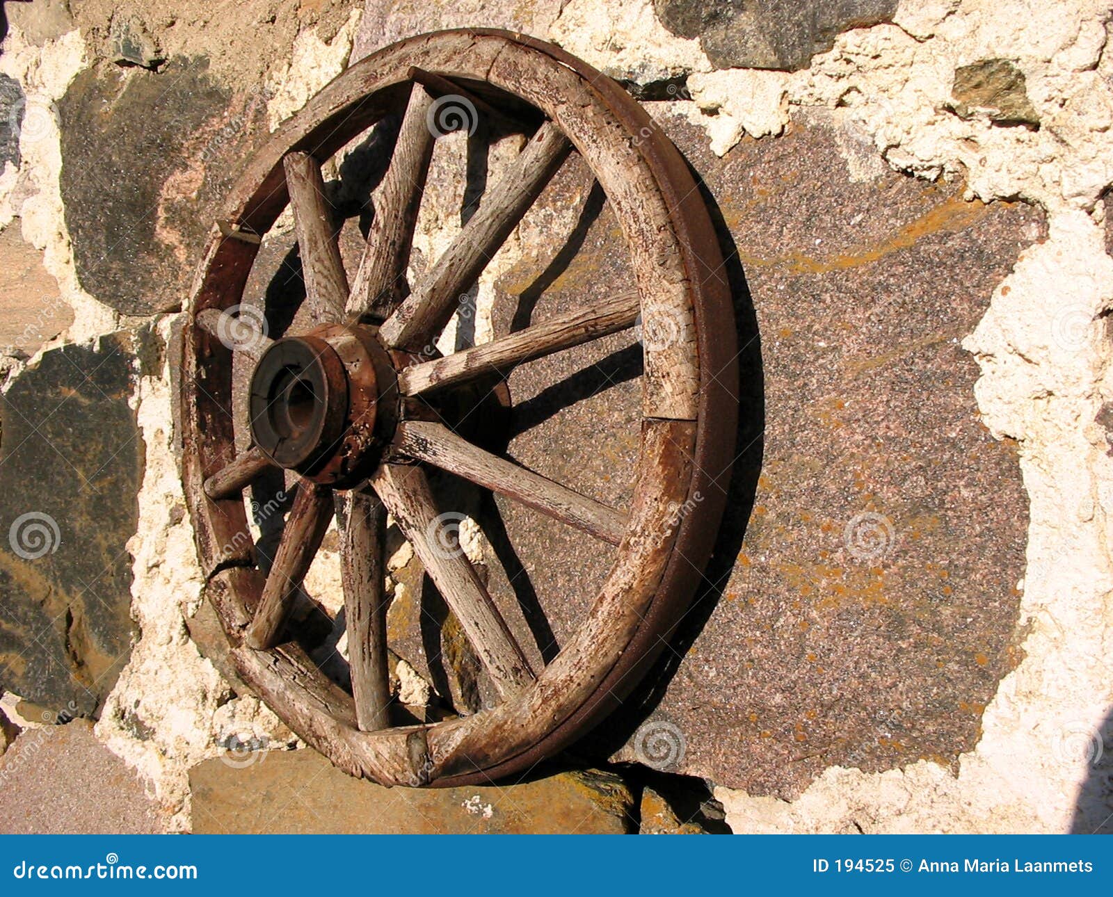 Old wheel stock image. Image of granite, barn, wall, stone - 194525