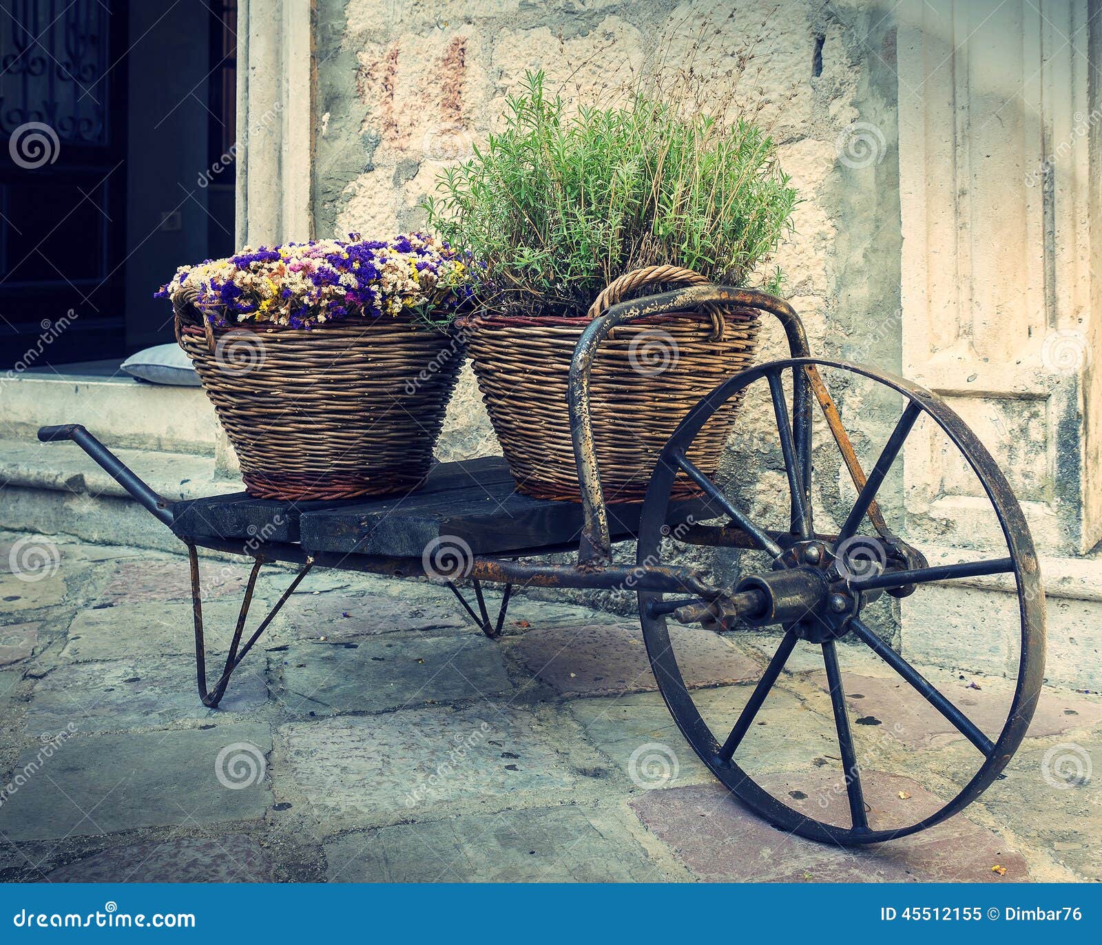 Old Wheelbarrow with Baskets of Flowers Stock Image - Image of floral ...