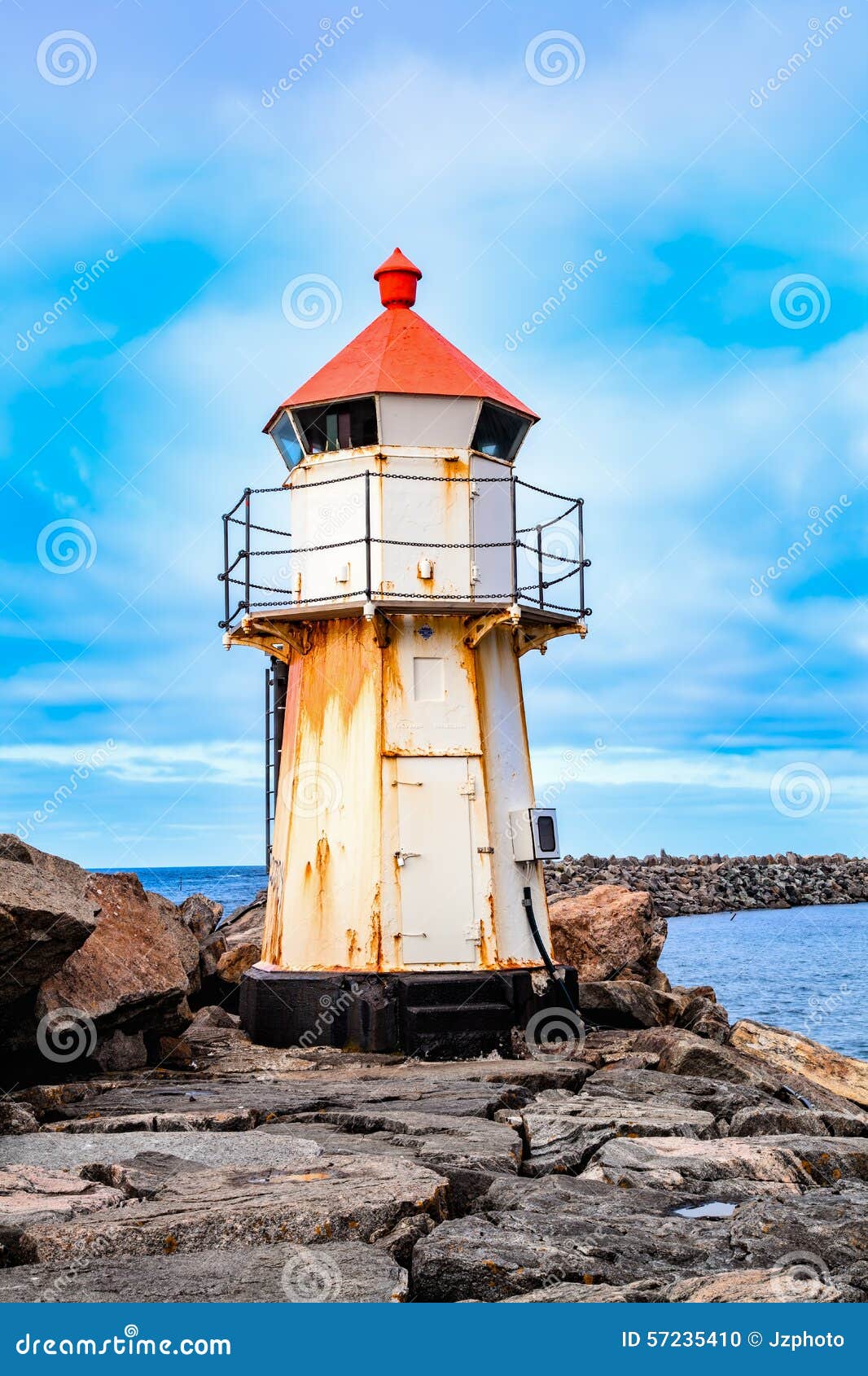 An Old White Lighthouse with Orange Roof Stock Photo - Image of stones ...