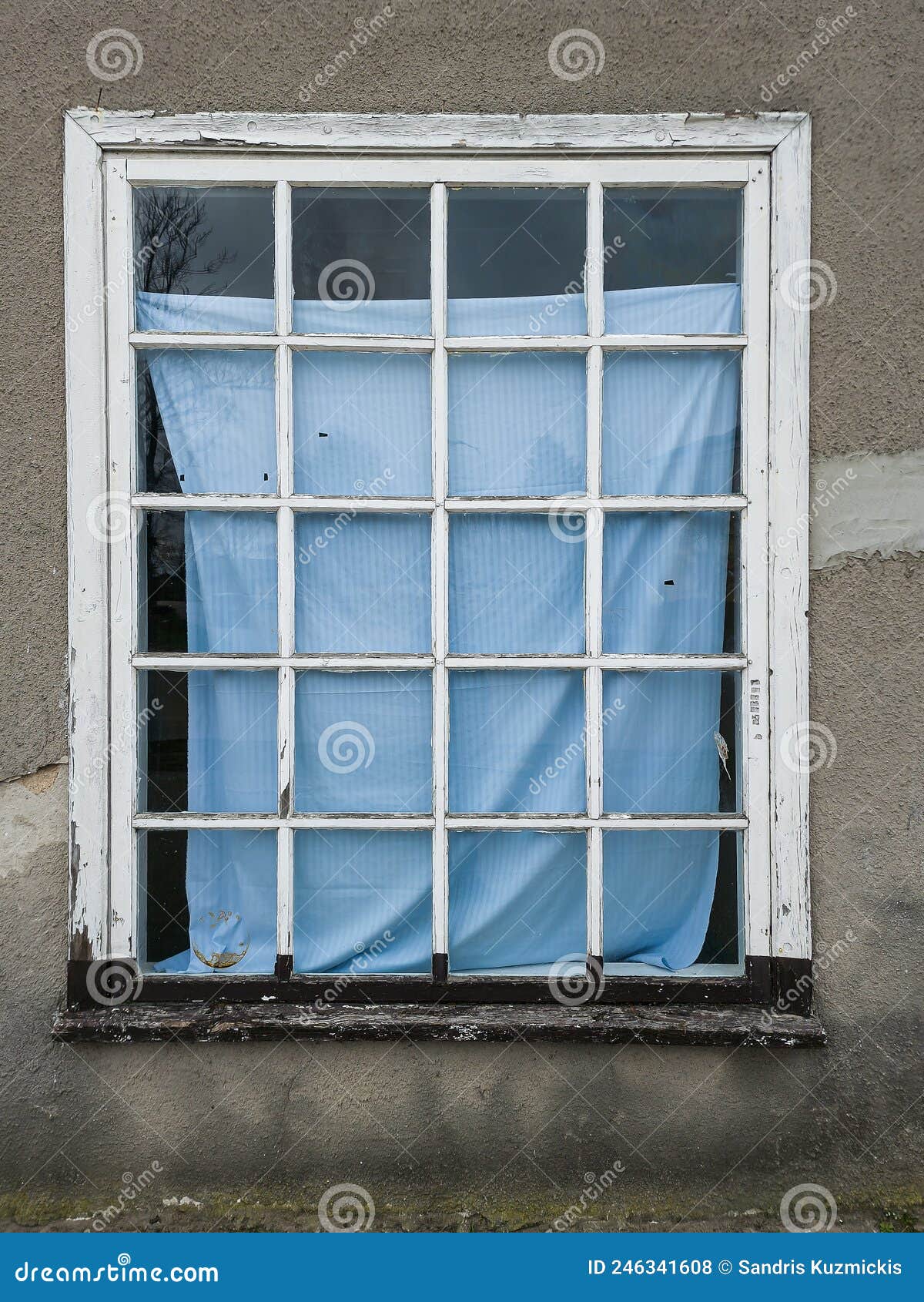 An Old White Wooden Window with Many Square Panes, Covered with a Blue ...