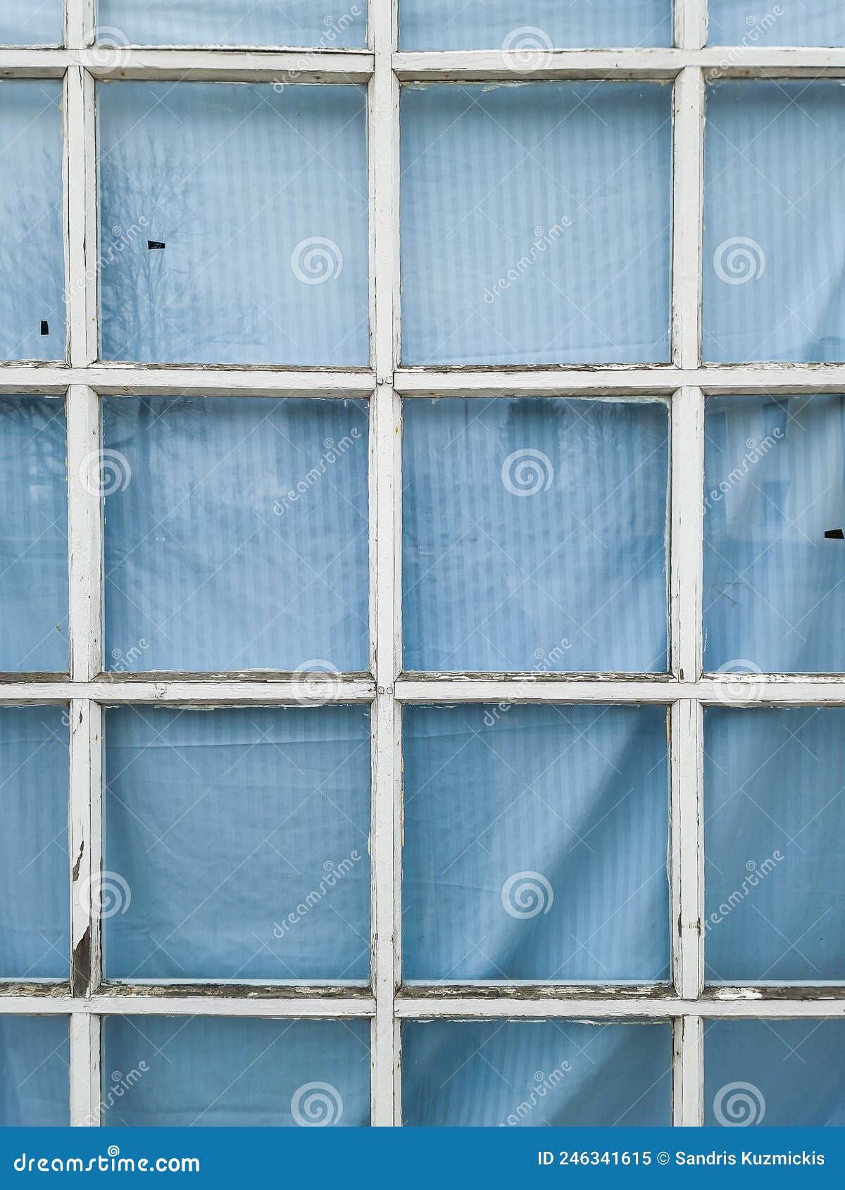 An Old White Wooden Window with Many Square Panes, Covered with a Blue ...