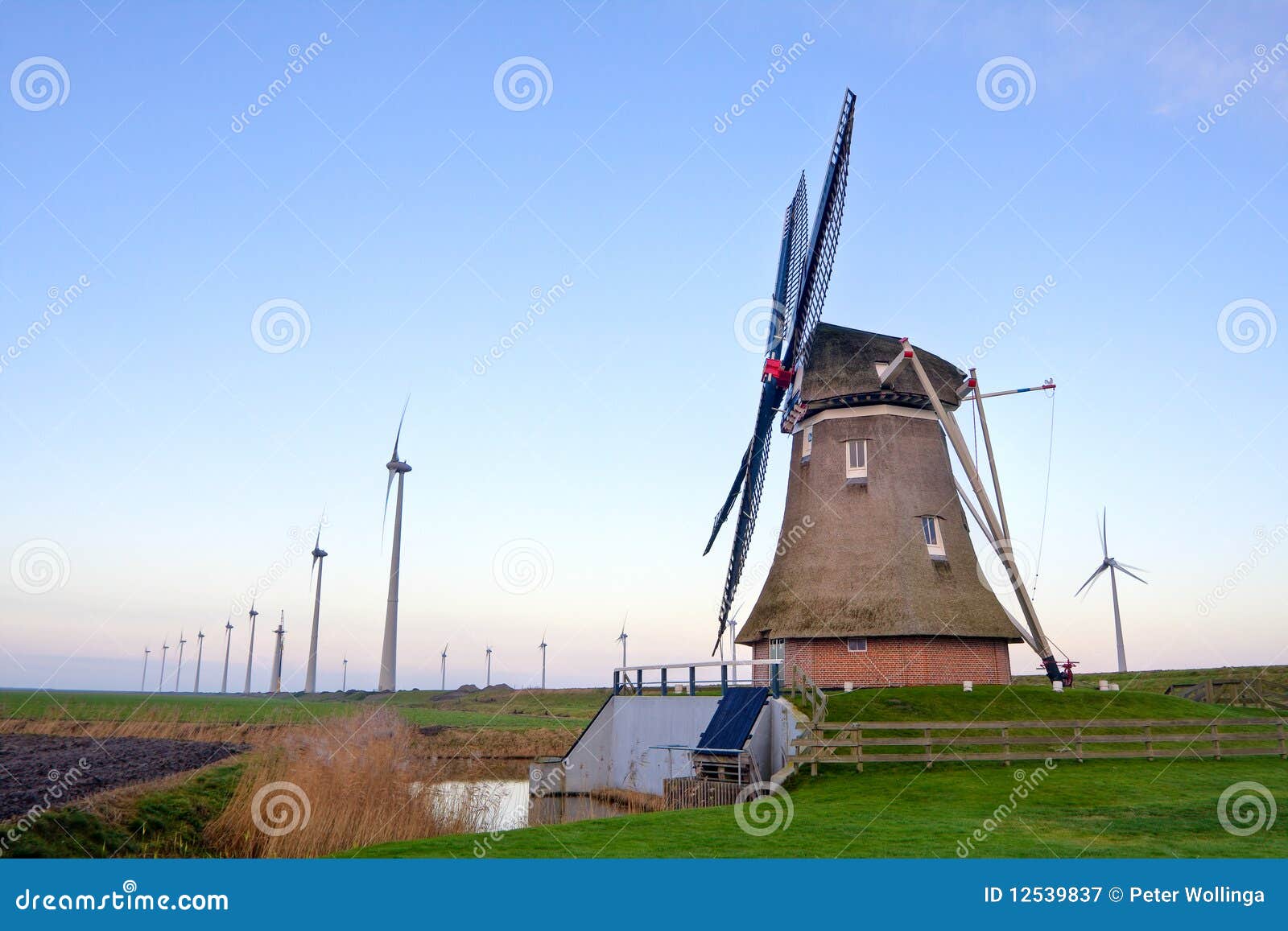 Old Windmill and New Windmills Stock Image - Image of grassland ...