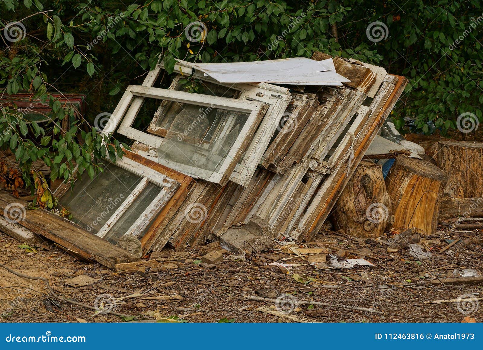 Old Construction Debris from Window Frames and Broken Glass on the ...