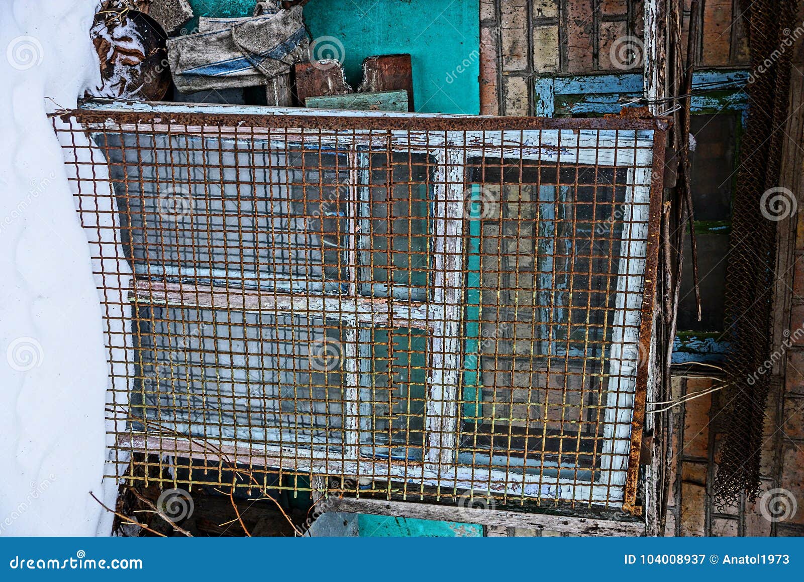 The Old Window with a Rusty Lattice Stands in the Snow on the Ground ...