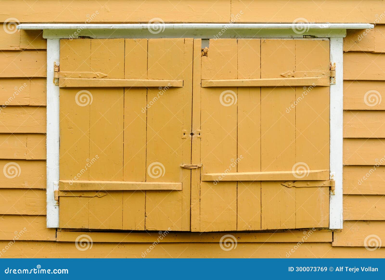 Yellow Shutters on a Building Stock Image - Image of shuttered, traditional: 300073769