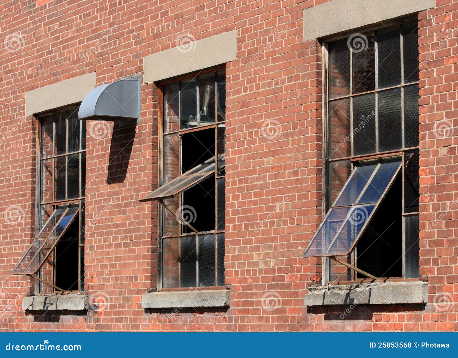 Old Brick Wall With A Narrow Window And Tiled Roof Behind It Stock ...