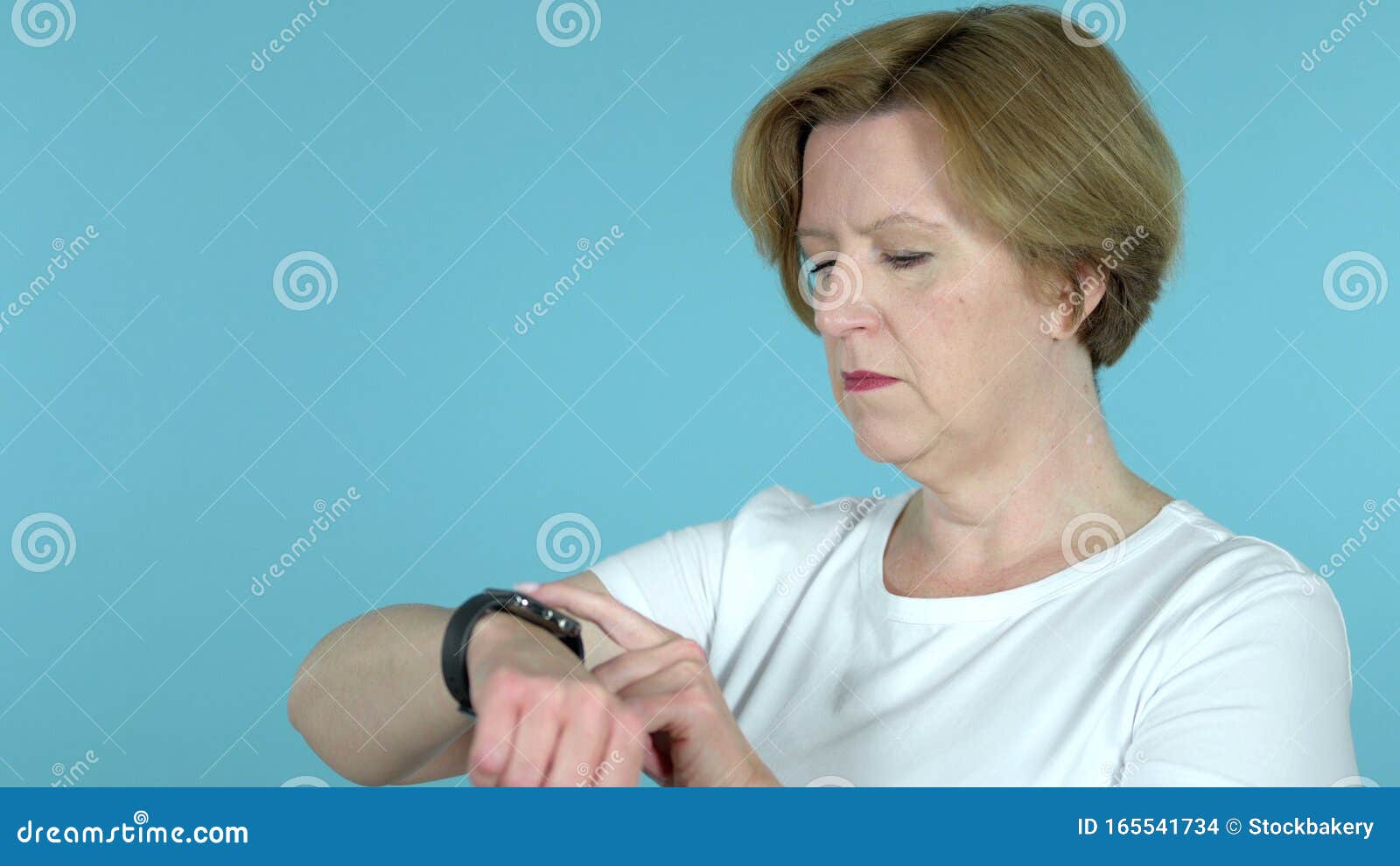 The Old Woman Browsing Internet, Using Smartwatch Stock Photo - Image ...