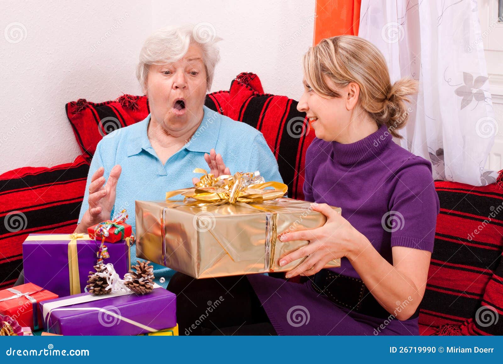Old Woman Gets a Gift from a Young One Stock Photo - Image of couple ...