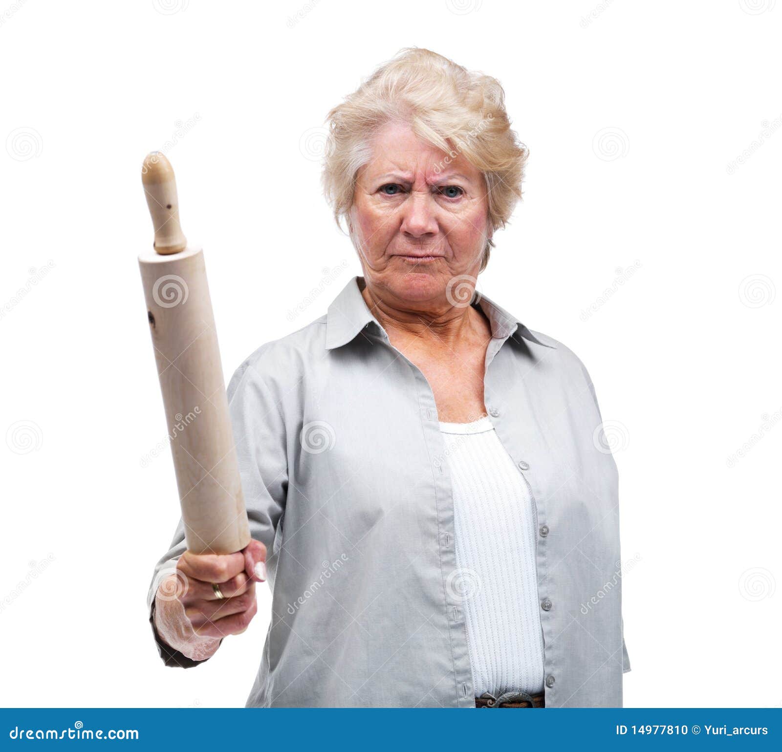 Stock Photo: Old woman holding a rolling pin. Image: 14977810