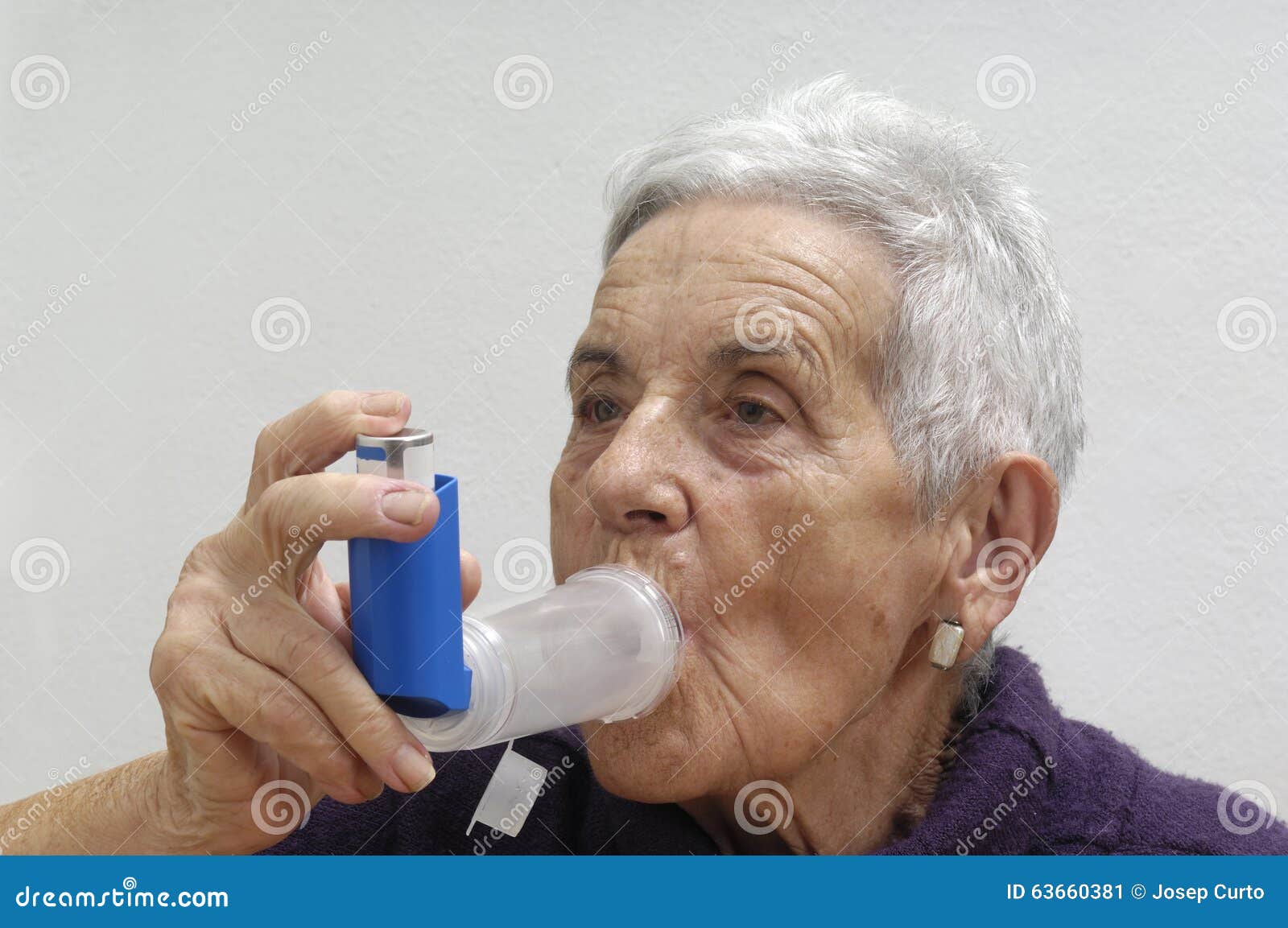 Old woman with an inhaler stock image. Image of illness - 63660381