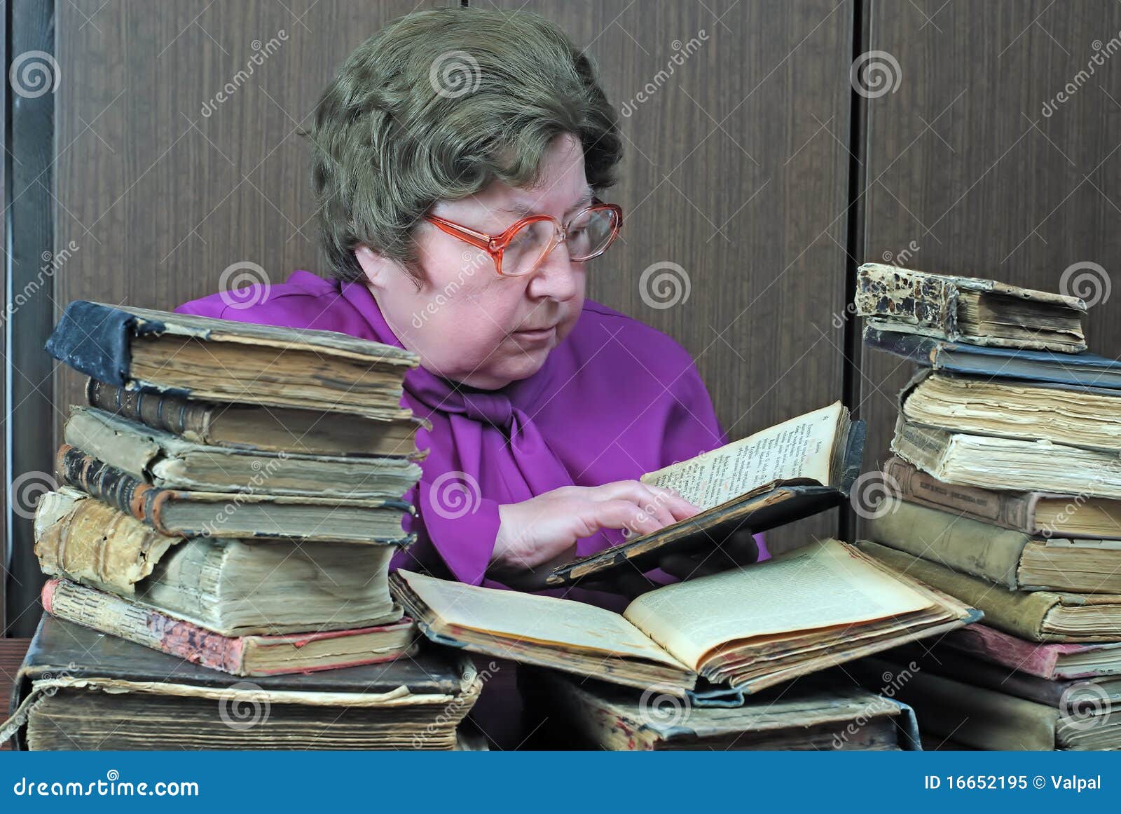Old woman in library stock image. Image of store, sitting - 16652195