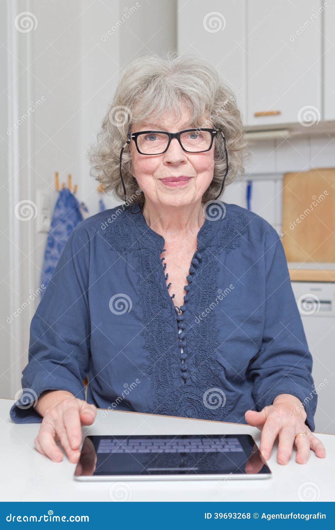 Old woman with tablet-pc stock photo. Image of computer - 39693268
