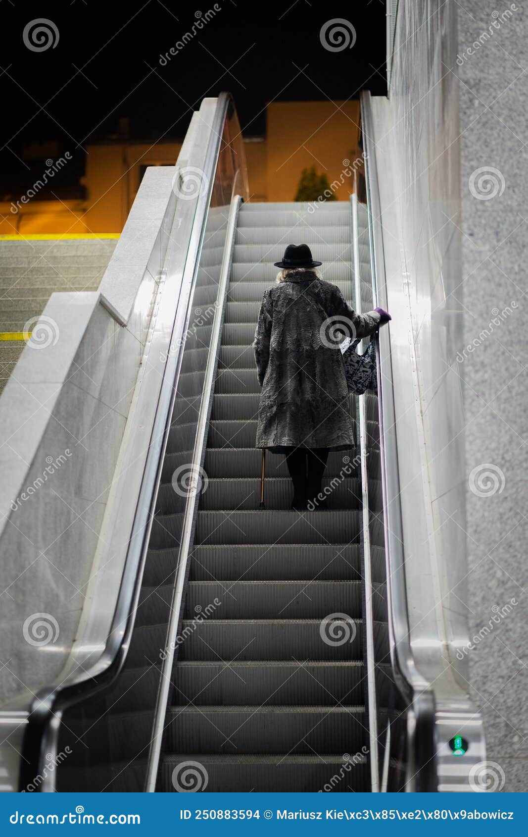 Old Woman at Train Station on Elevator Stairs Stock Photo - Image of ...