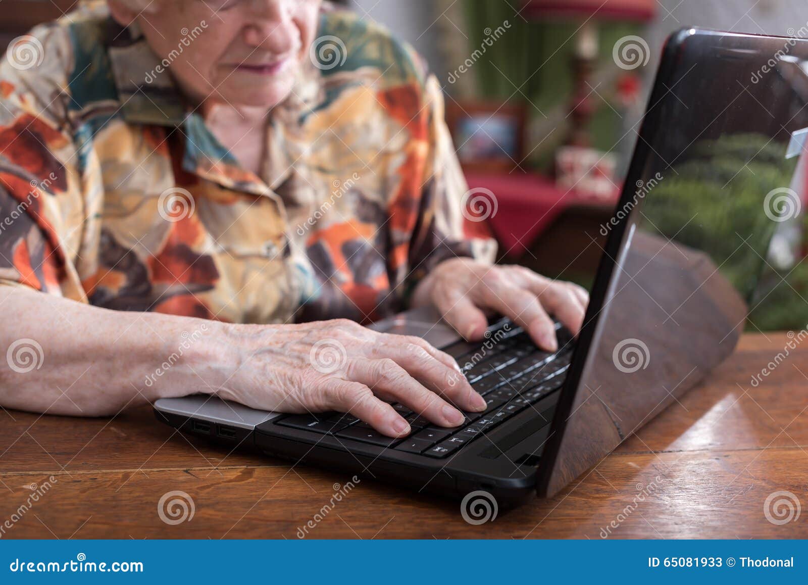 Old woman using a laptop stock image. Image of technology - 65081933