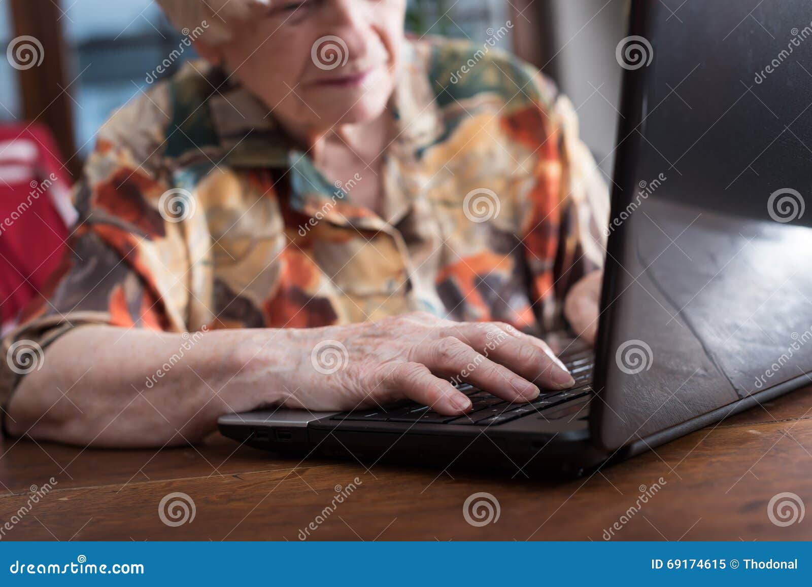 Old woman using a laptop stock image. Image of retired - 69174615