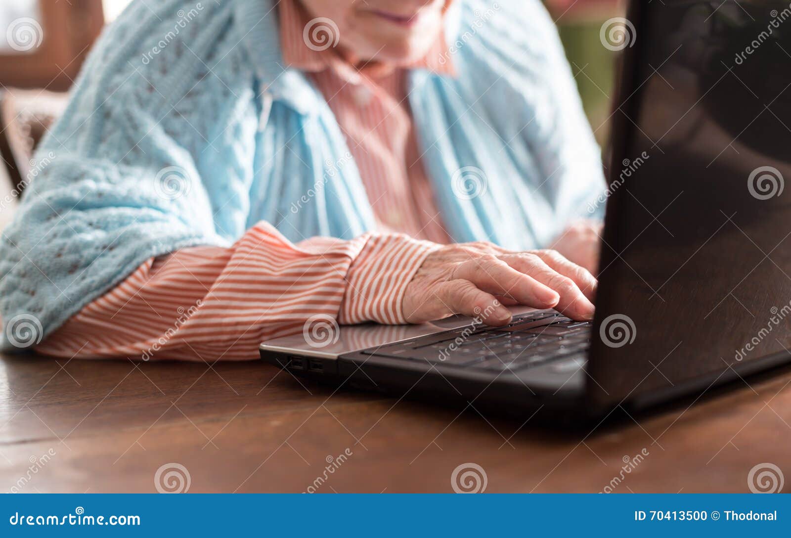 Old woman using a laptop stock photo. Image of information - 70413500