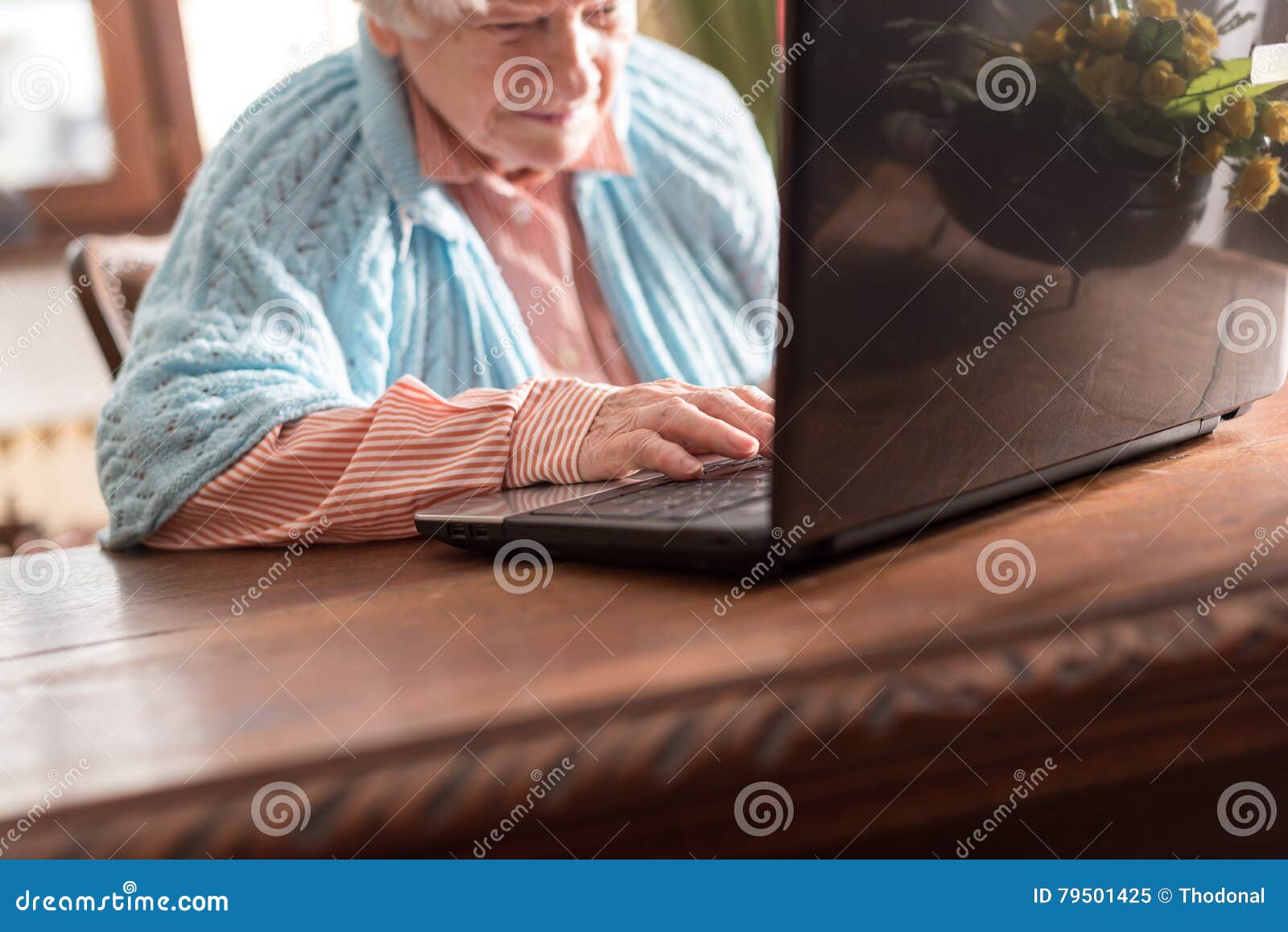 Old woman using a laptop stock image. Image of hand, internet - 79501425